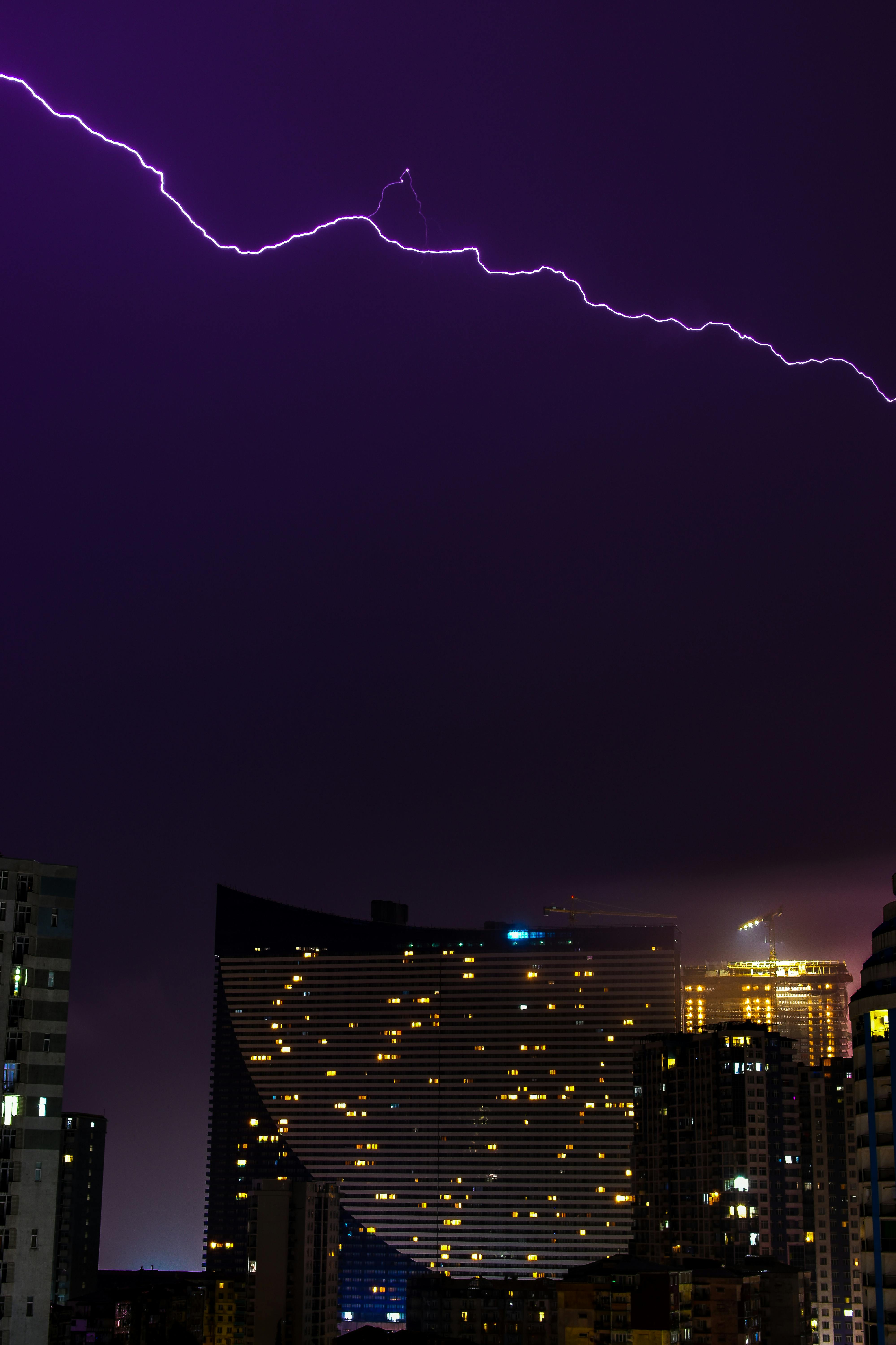 Lightning on Purple Sky over City · Free Stock Photo