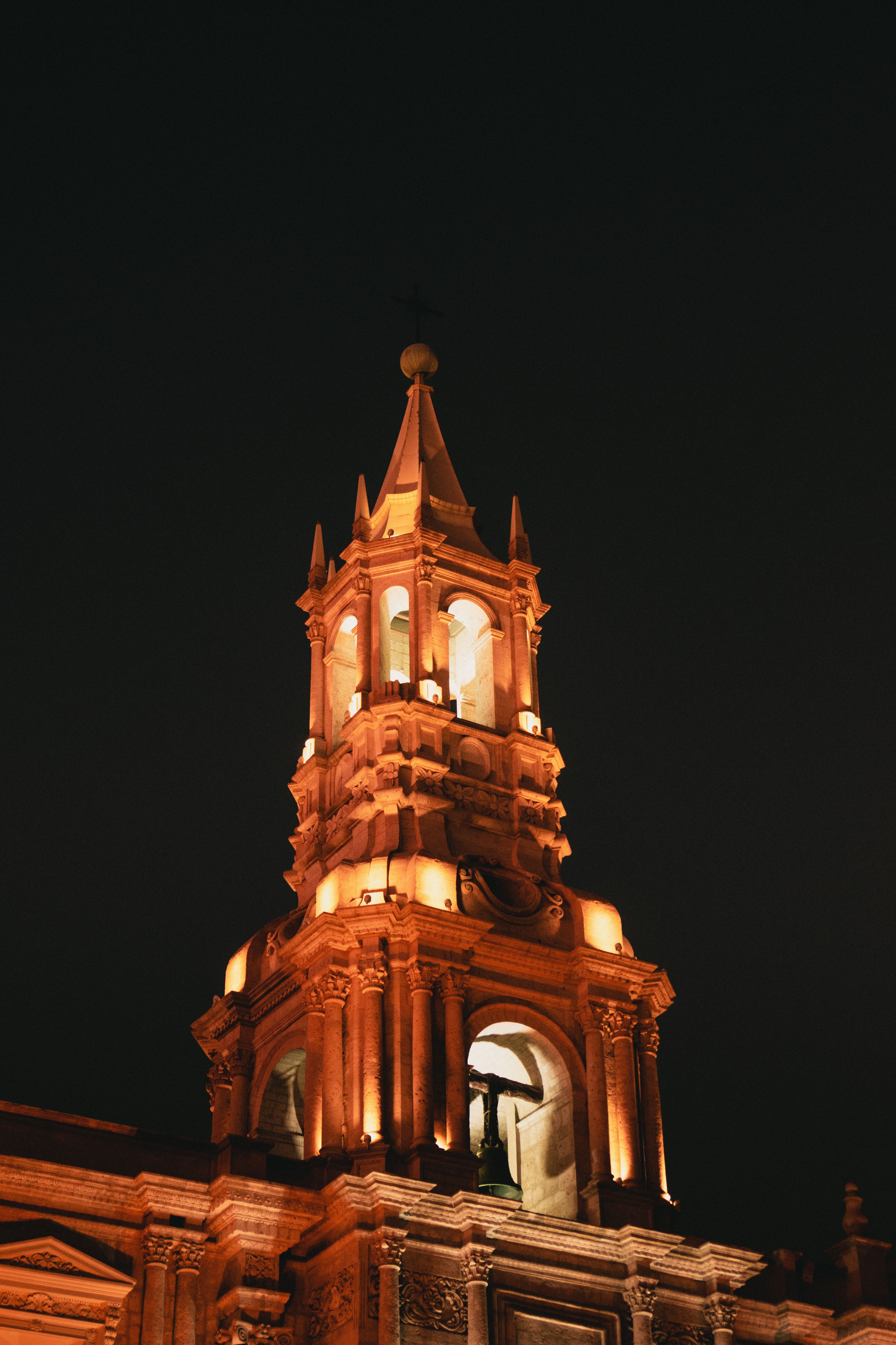 Illuminated Church Tower at Night · Free Stock Photo