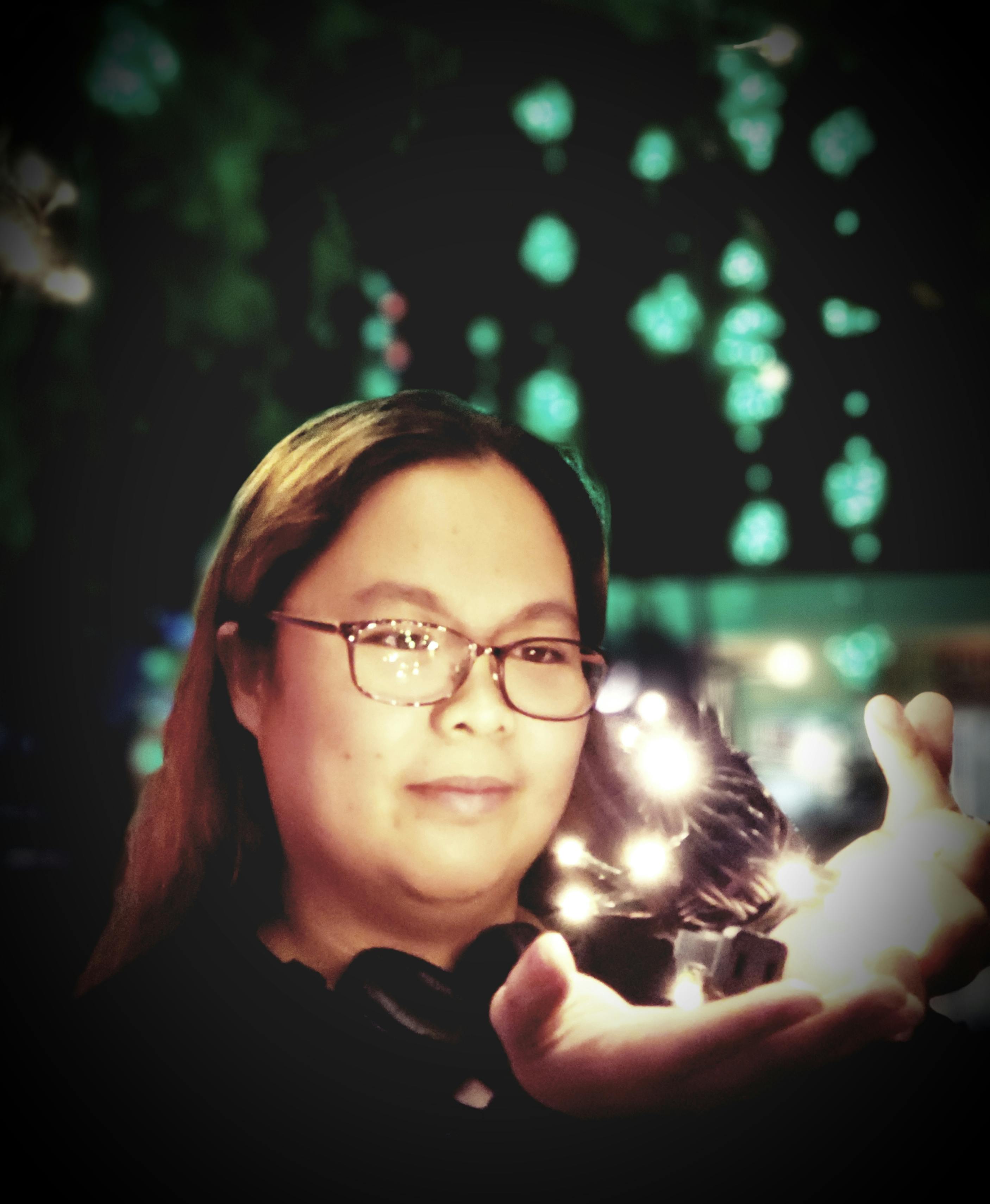 Woman Holding White String Lights · Free Stock Photo