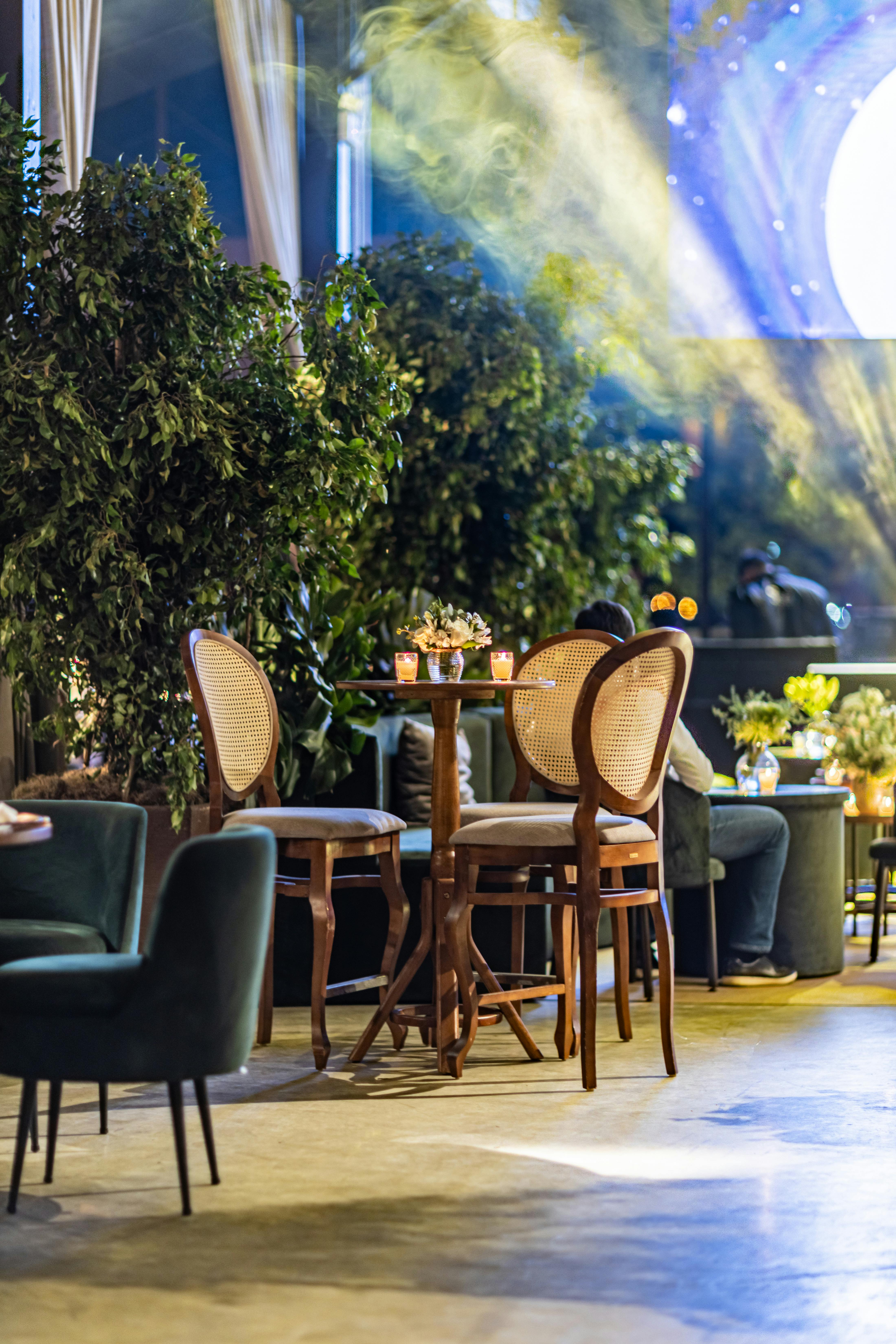 Small Round Tables and Chairs in a Modern Restaurant · Free Stock Photo