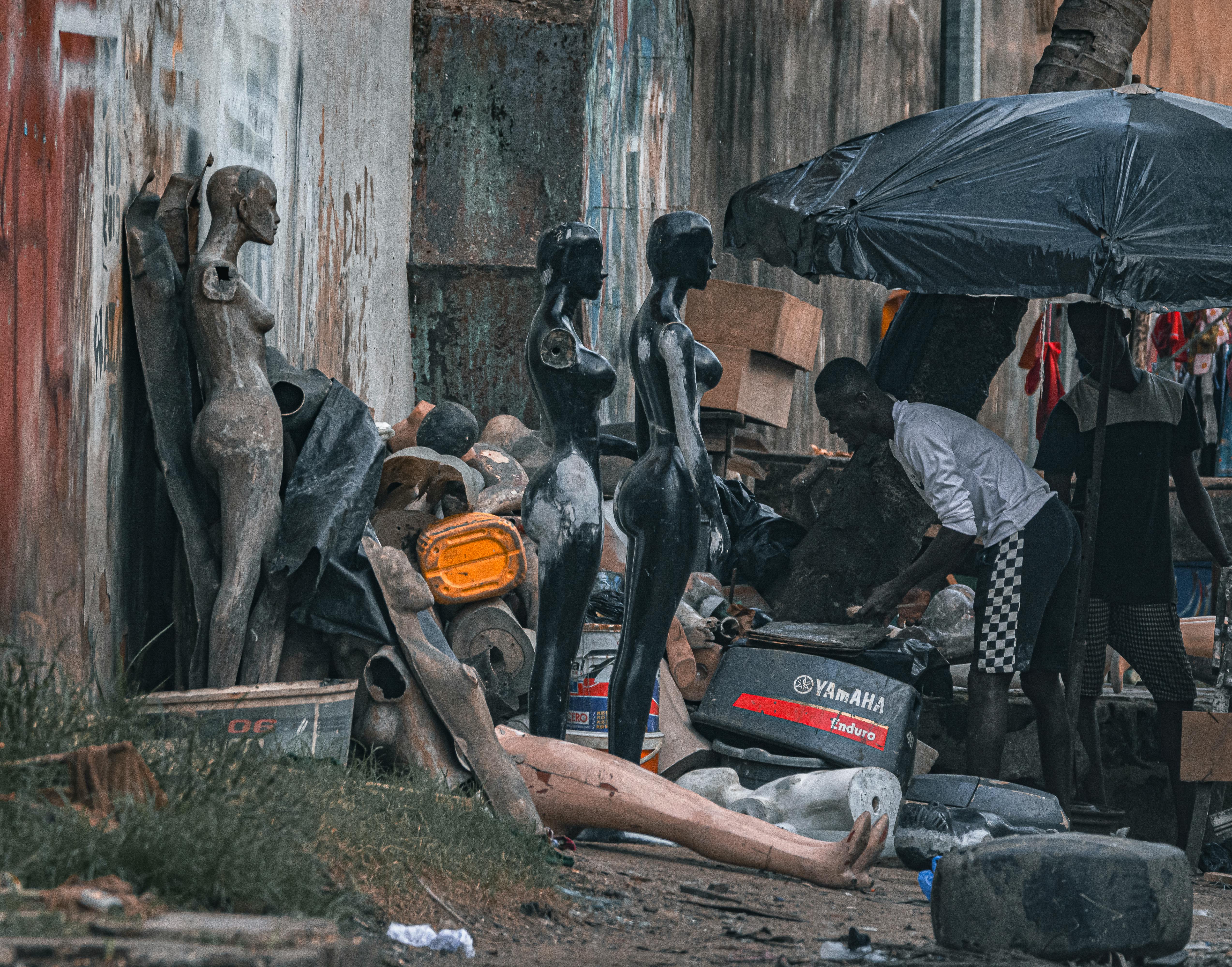 Men Looking through Garbage on the Sidewalk · Free Stock Photo
