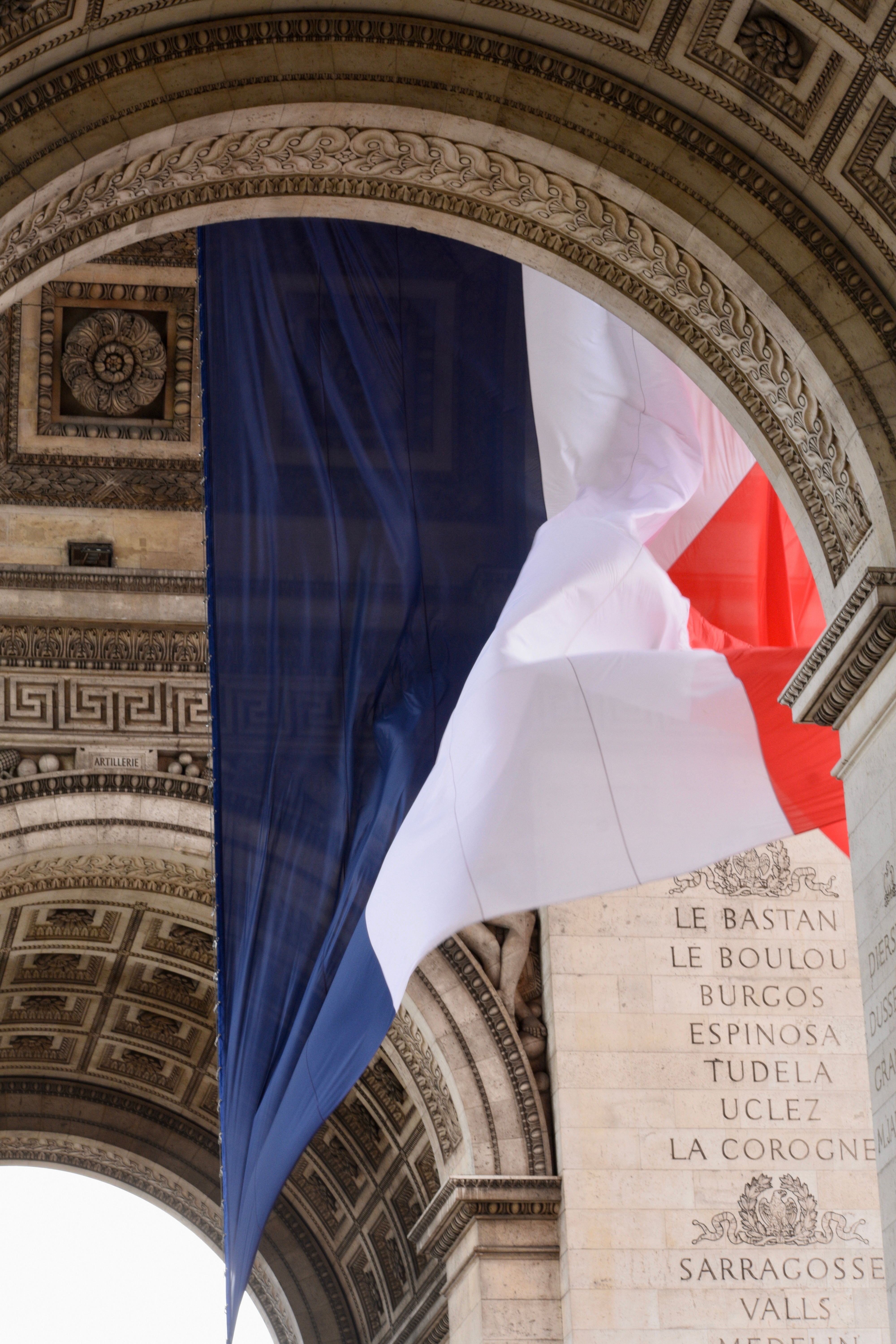French Flag Hanging in Arch · Free Stock Photo