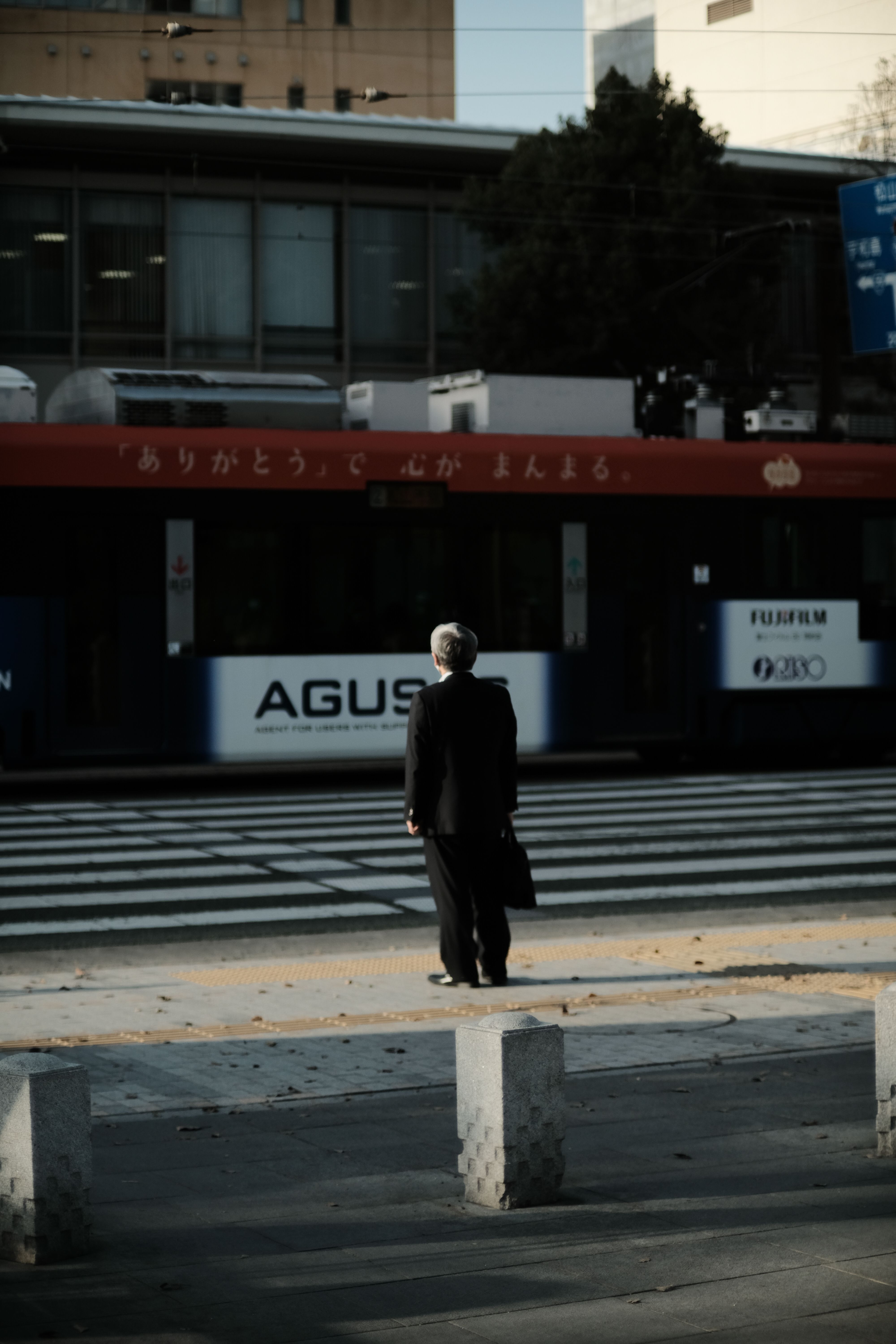 Man in Suit Waiting at Crosswalk · Free Stock Photo