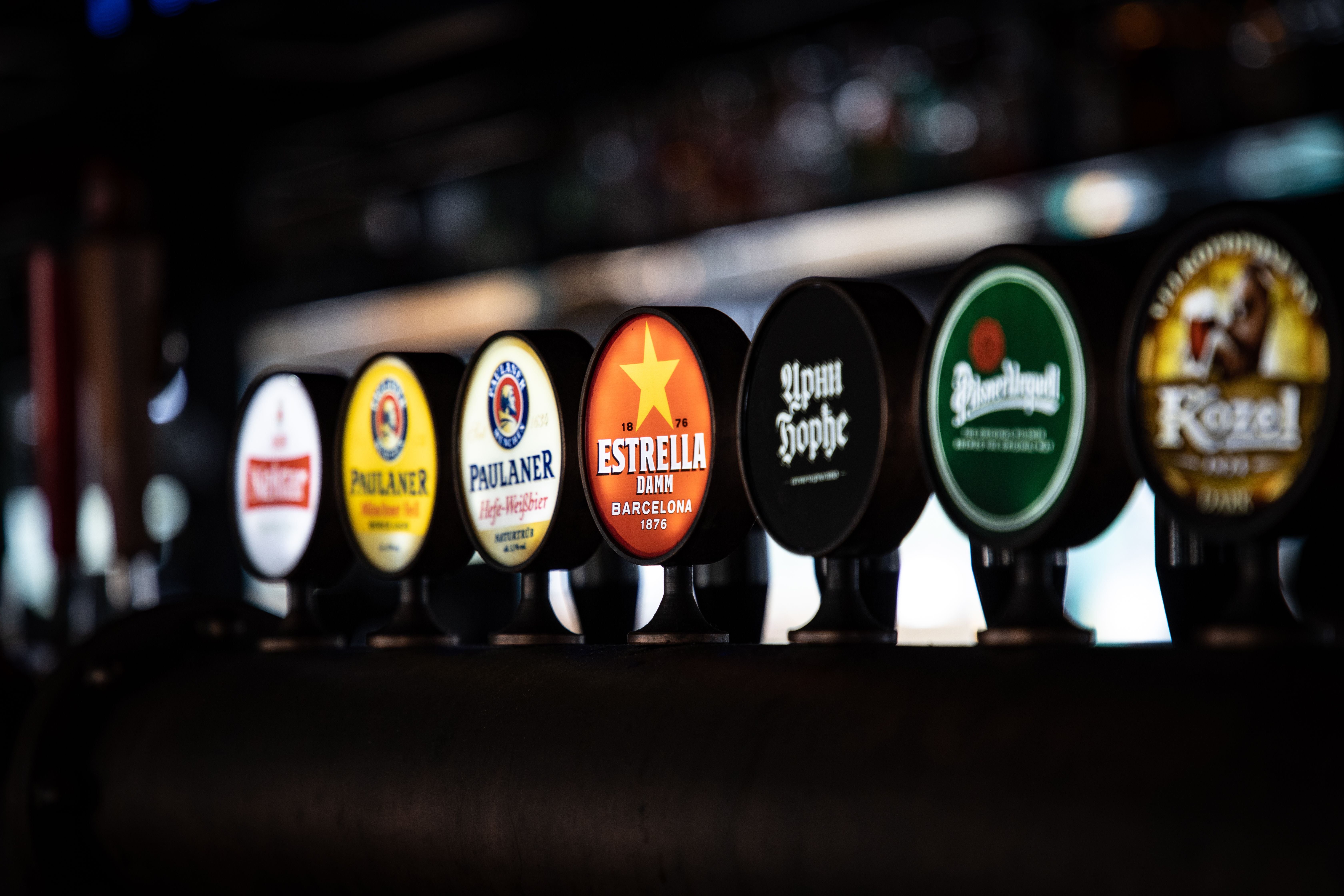 Beer Logos in Bar · Free Stock Photo
