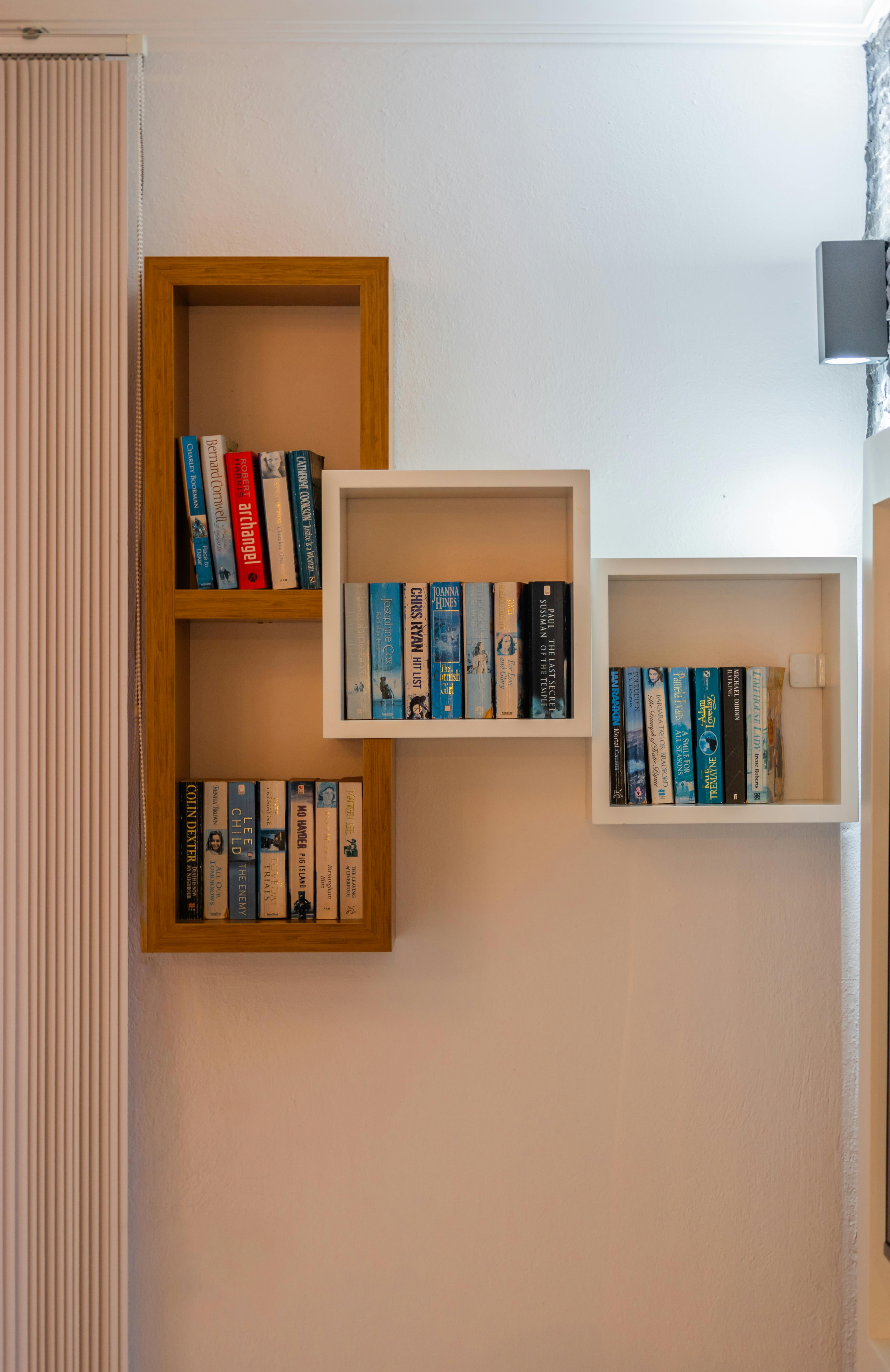 Irregular Shape Bookshelves on the Wall · Free Stock Photo