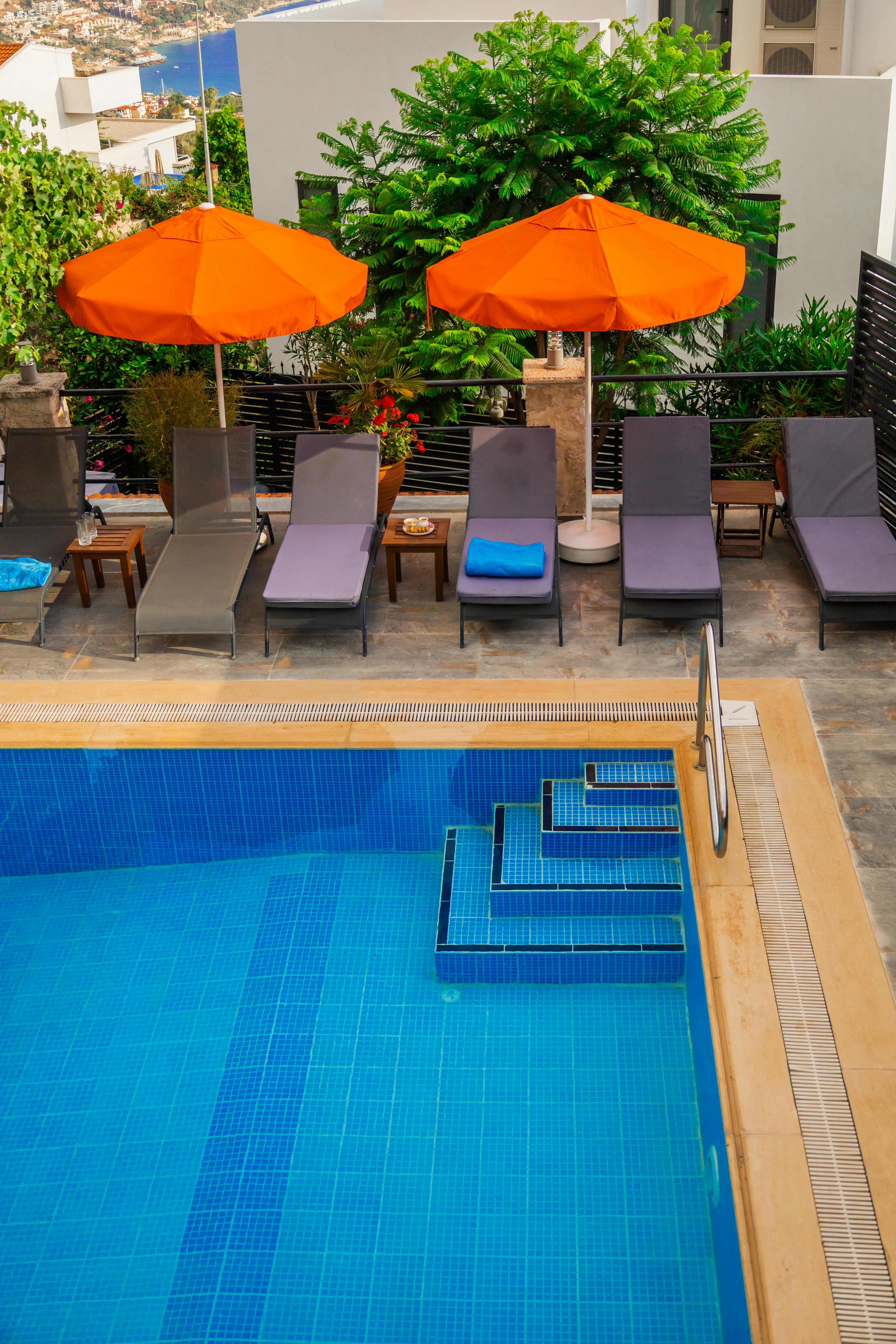 Sunbeds by Pool at Holiday Resort · Free Stock Photo