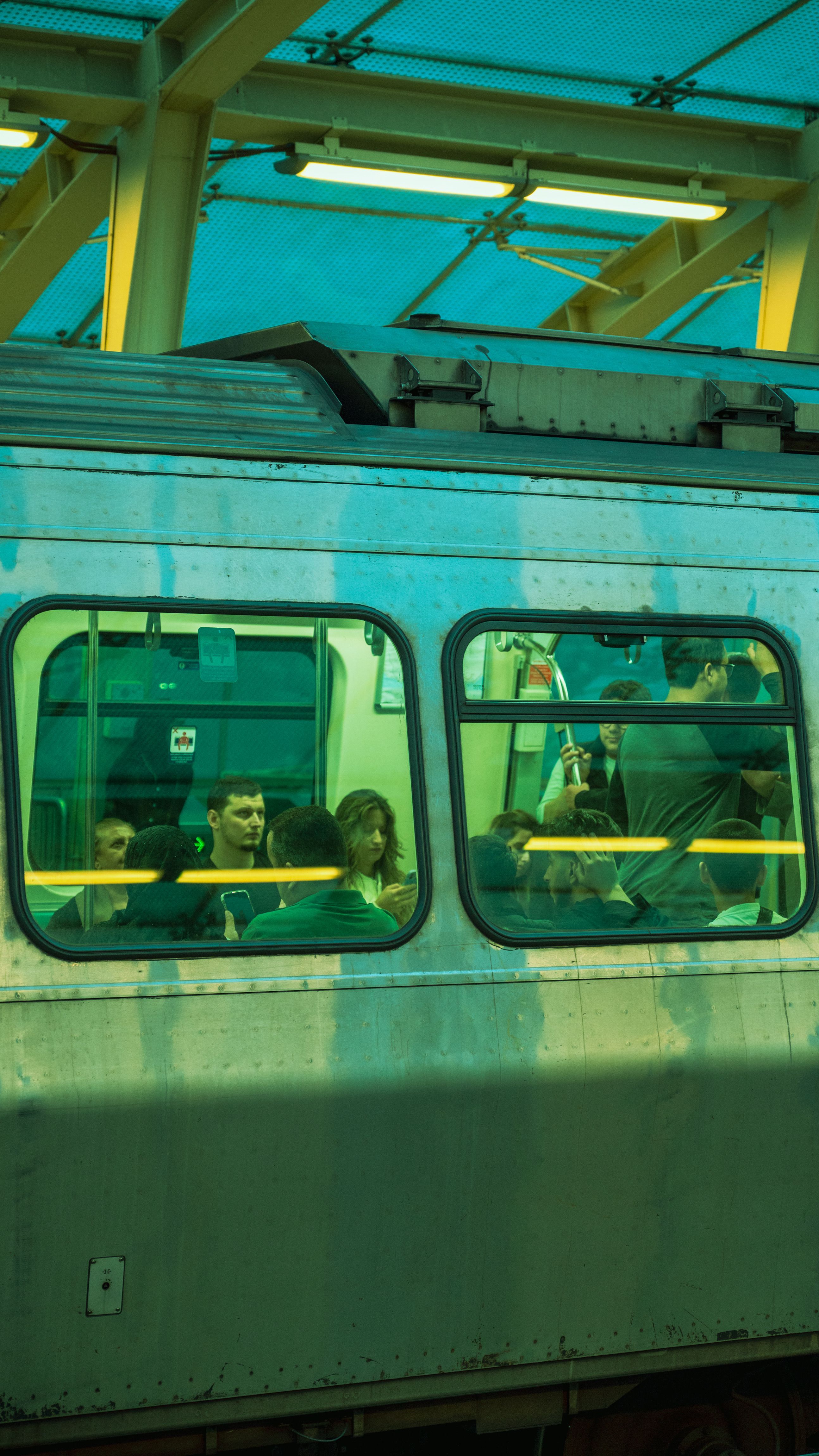 People in a Subway Photographed from the Outside · Free Stock Photo
