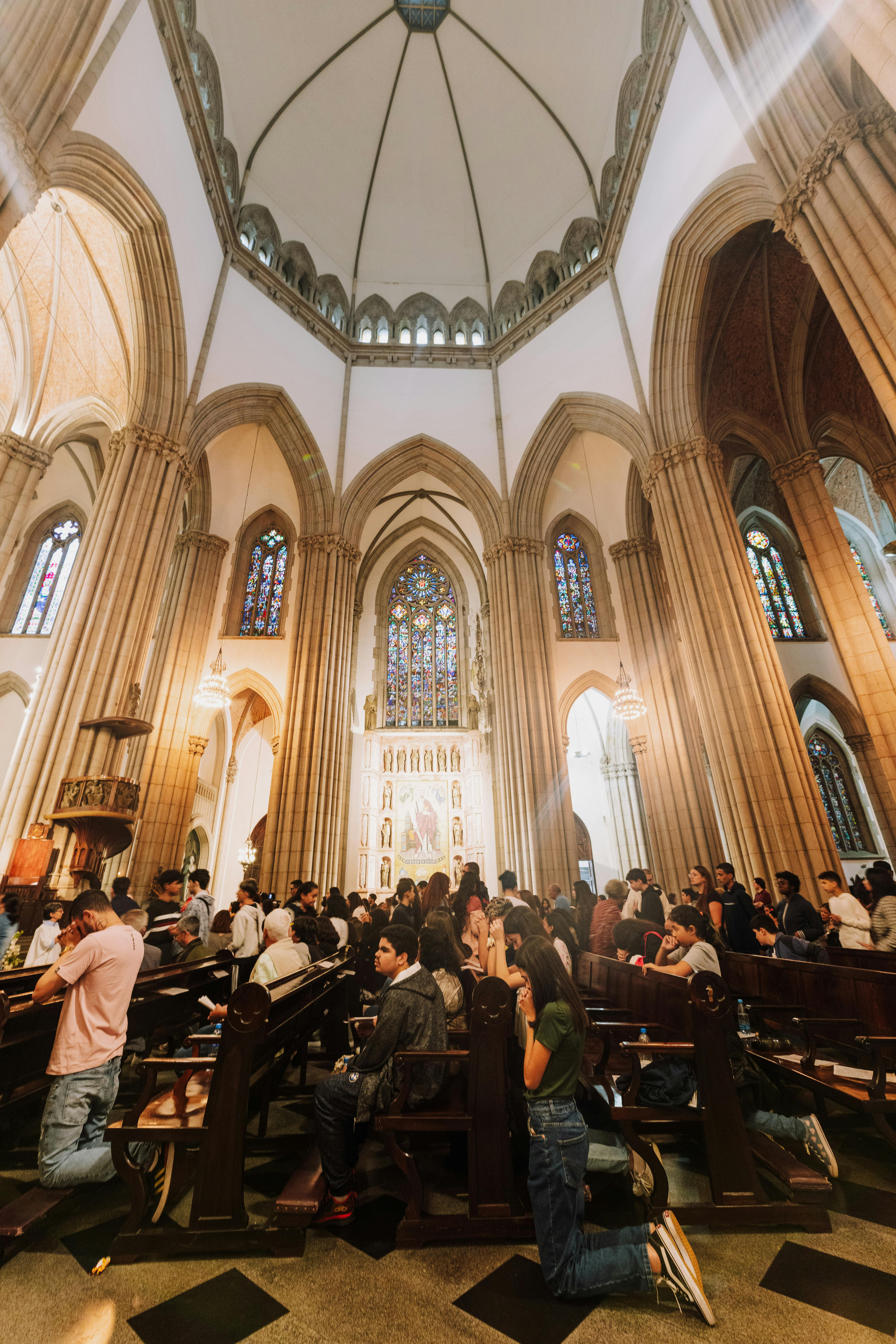 People Kneeling and Praying in the Church · Free Stock Photo