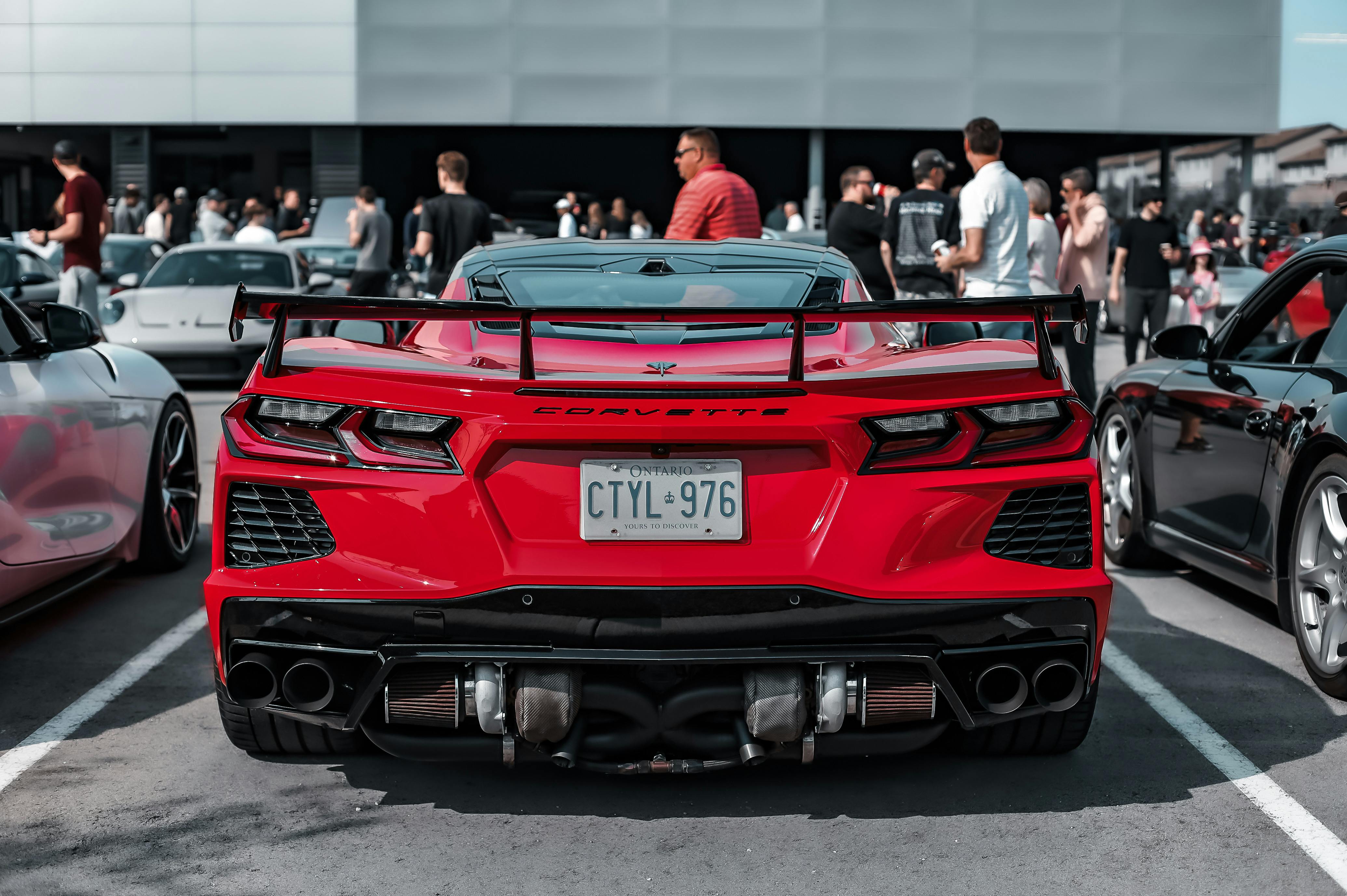Red Chevrolet Corvette C8 on a Parking Lot · Free Stock Photo