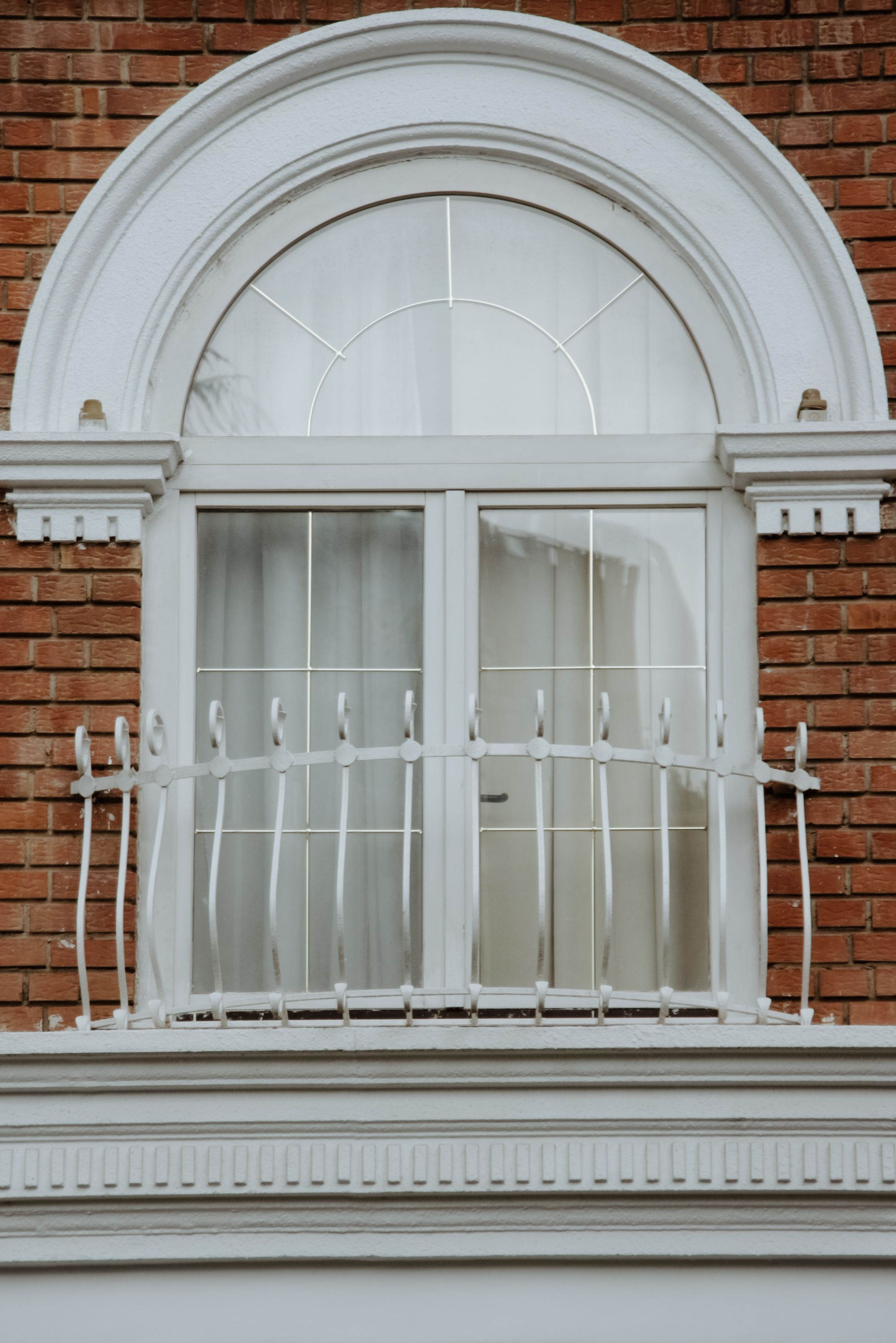 A window with a white railing and a white window · Free Stock Photo