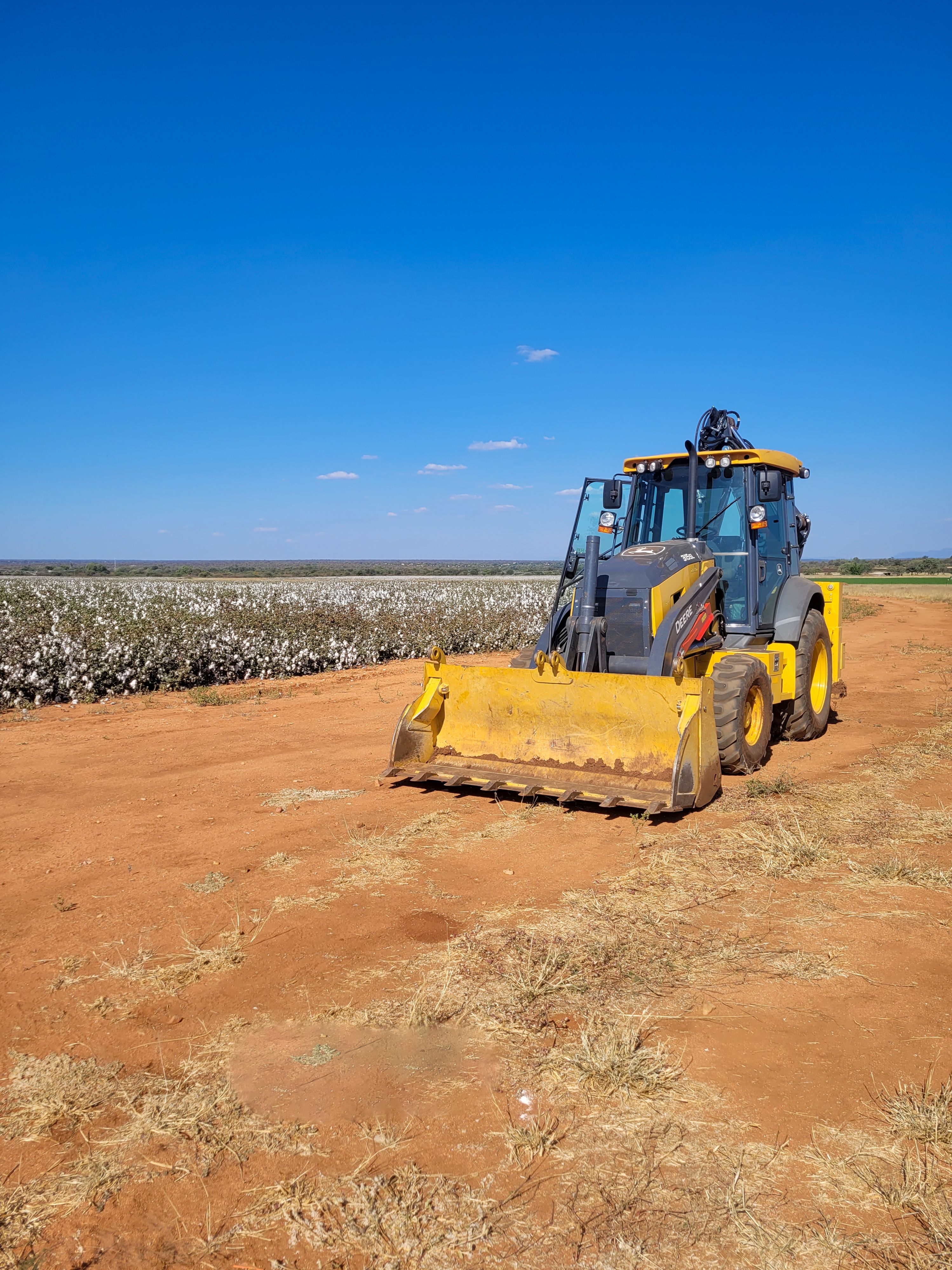 View of a Power Shovel Tractor on a Field under Blue Sky · Free Stock Photo