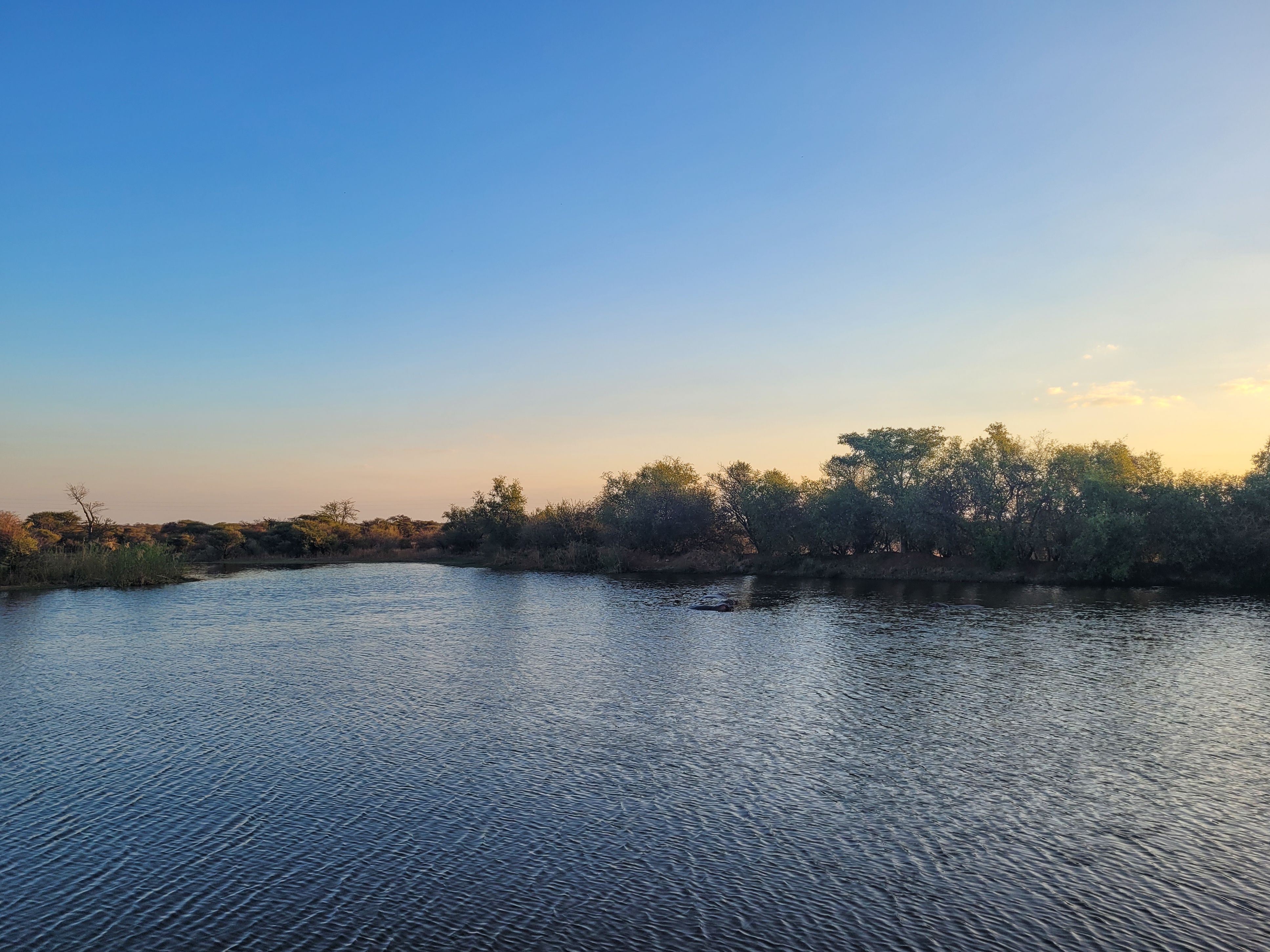 Clear Sky over River at Sunset · Free Stock Photo