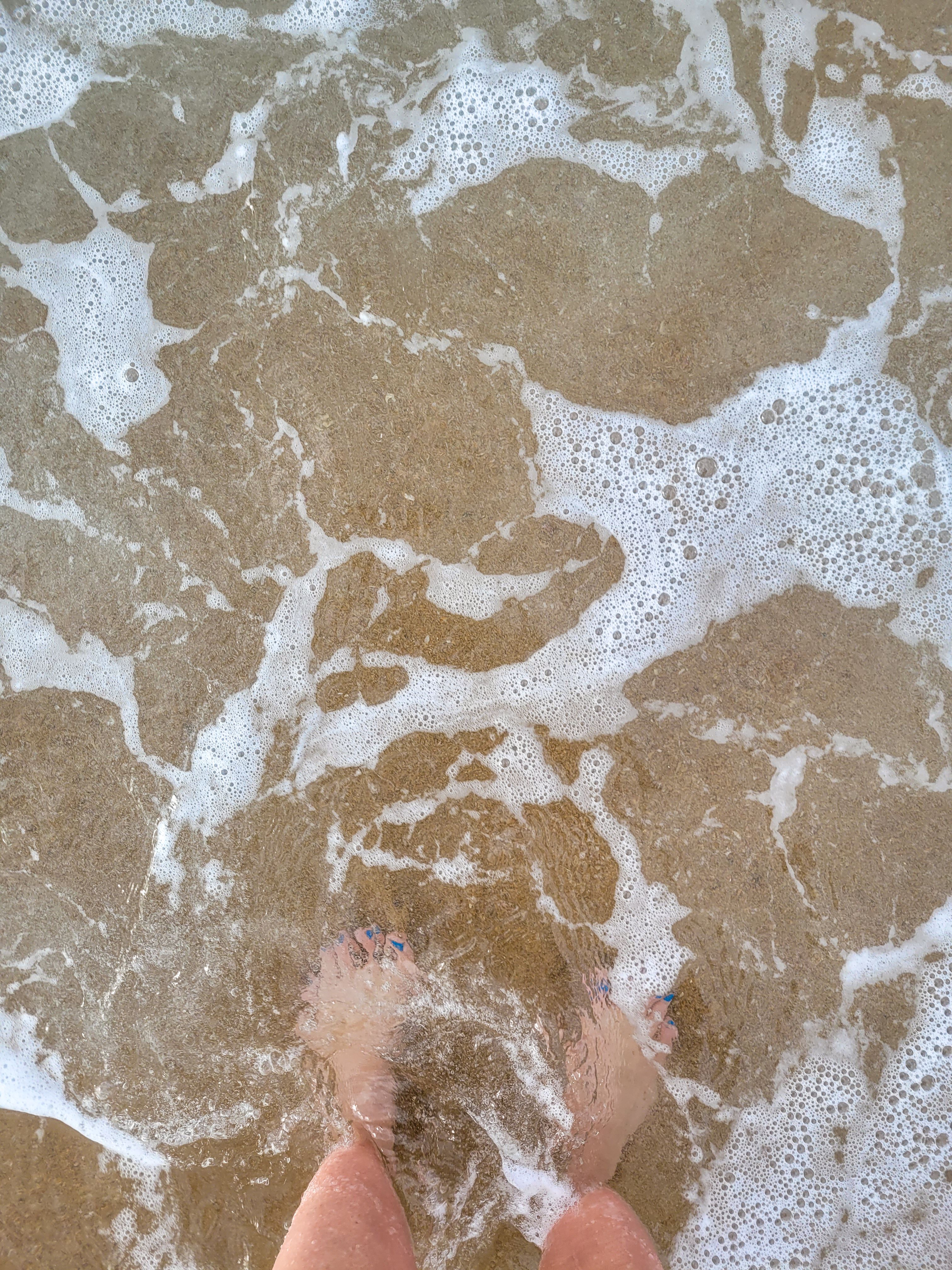 First Person Perspective of Woman Standing Ankles Deep in Water · Free ...