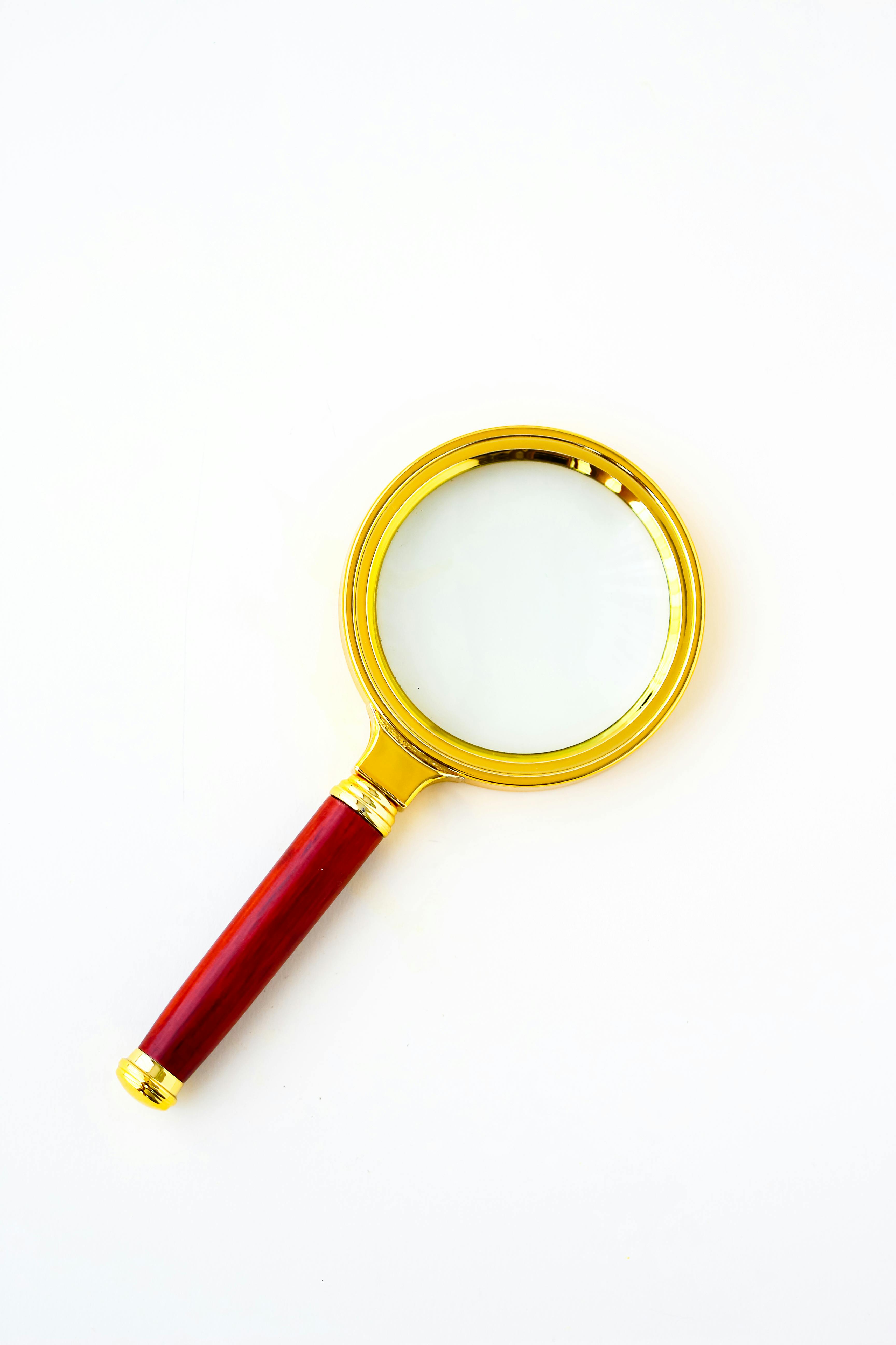 Selective Focus Photo of Magnifying Glass · Free Stock Photo