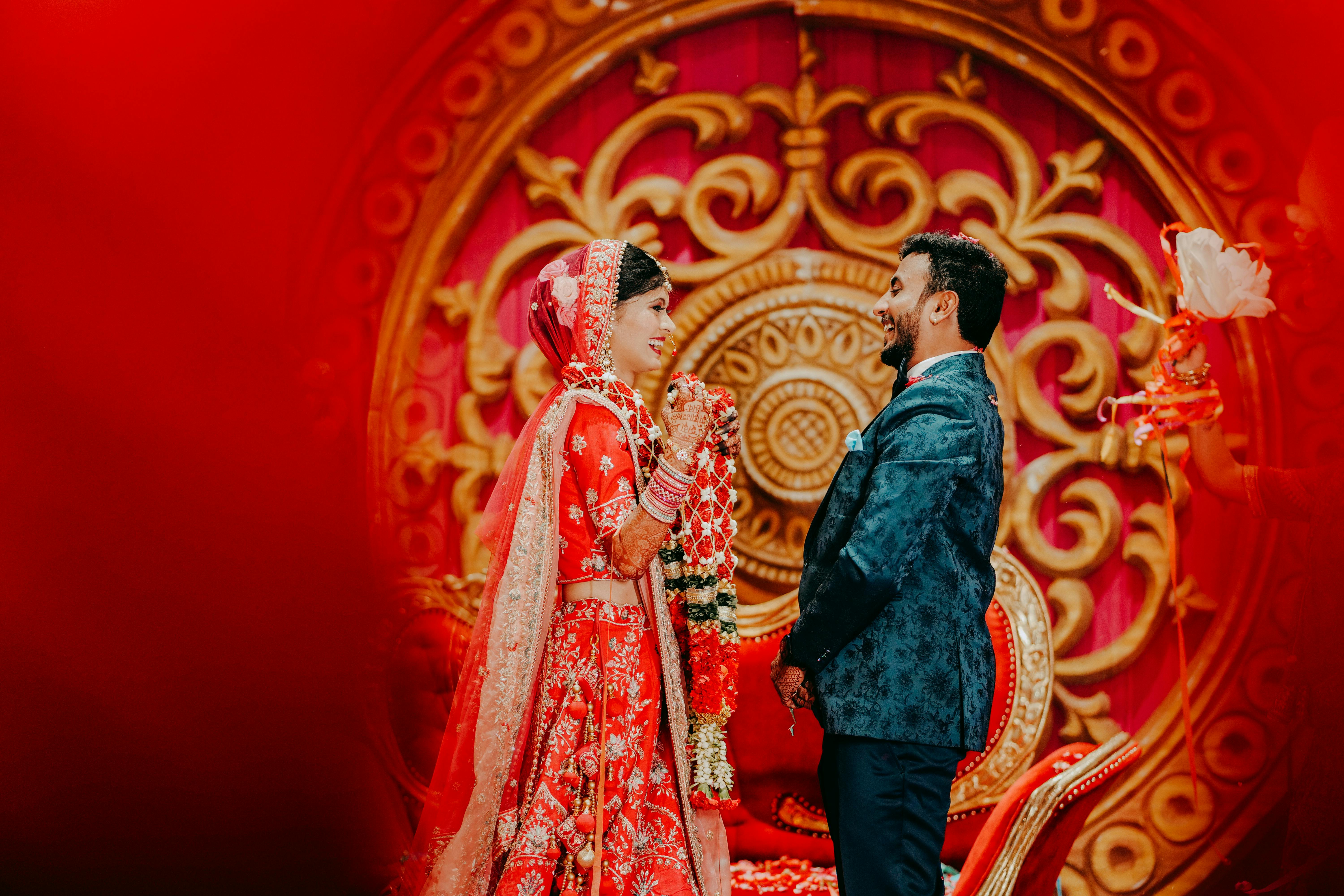 Cheerful Wedding Couple against an Ornamental Red Decoration · Free ...