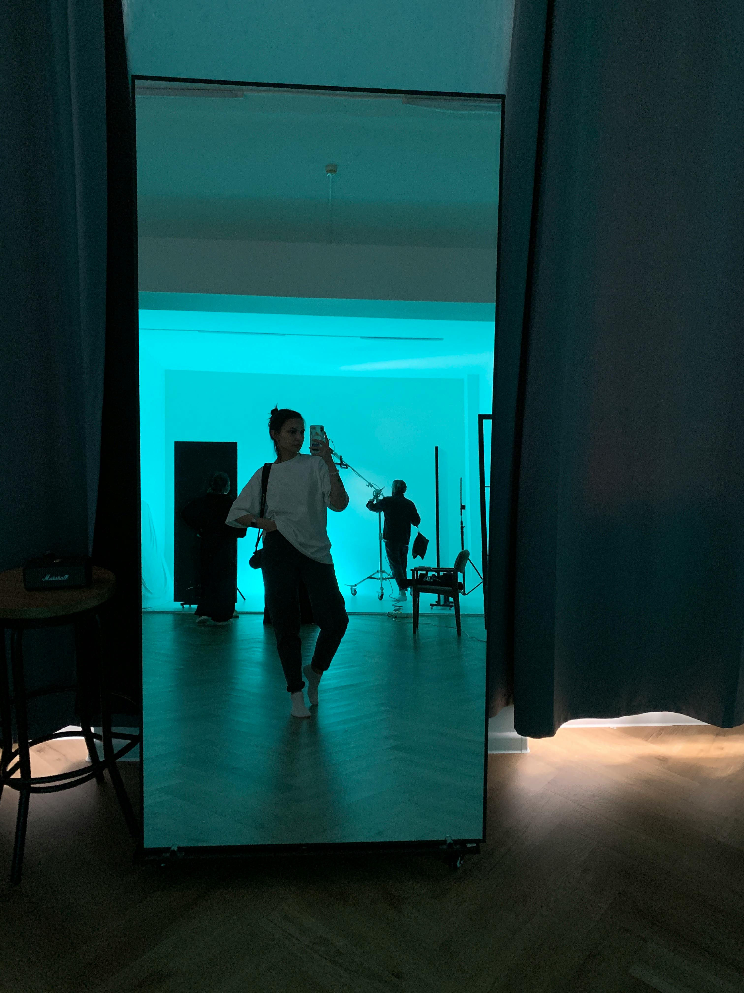 Mirror Reflecting People in the Studio · Free Stock Photo