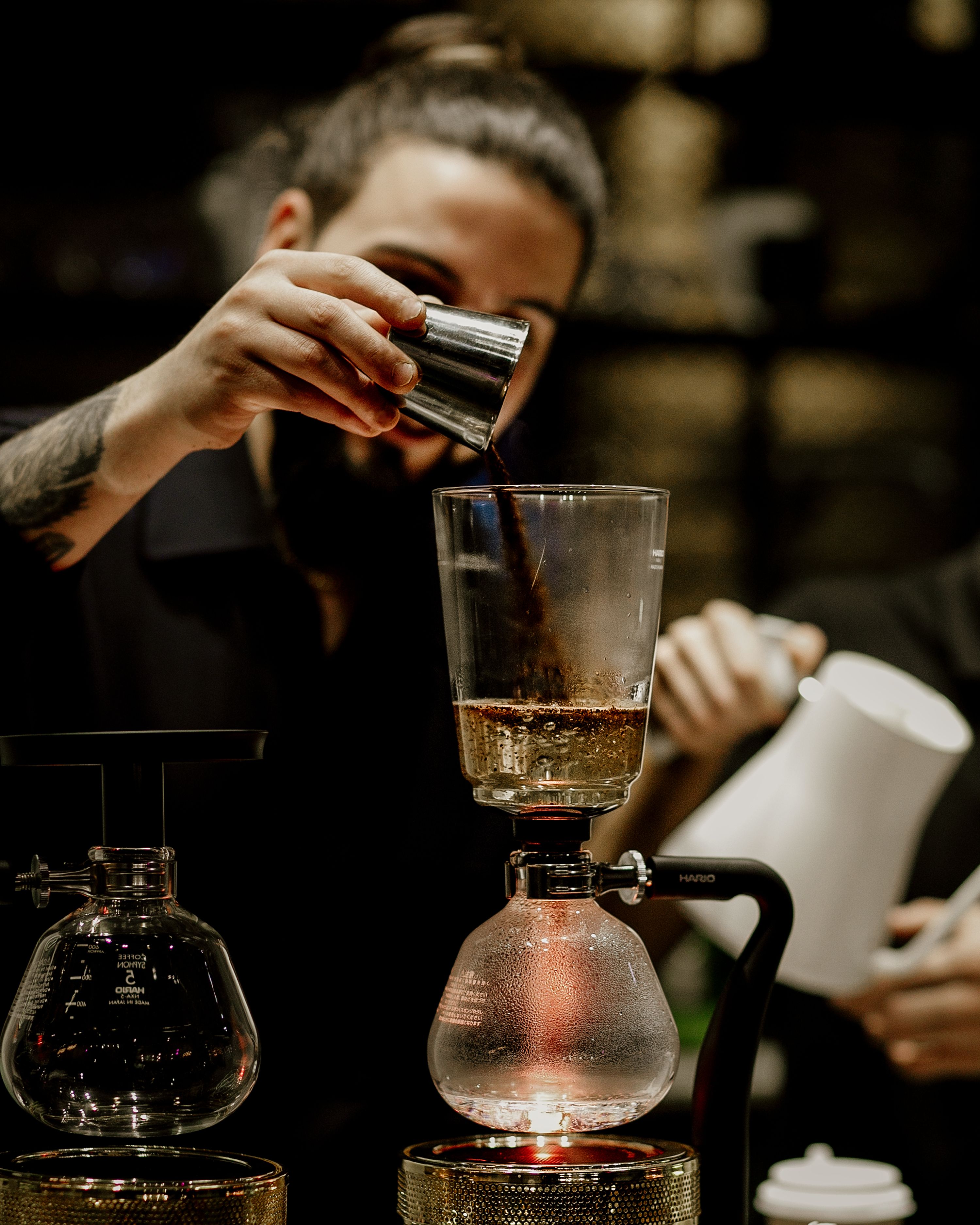 Woman Preparing Coffee in a Cafe · Free Stock Photo