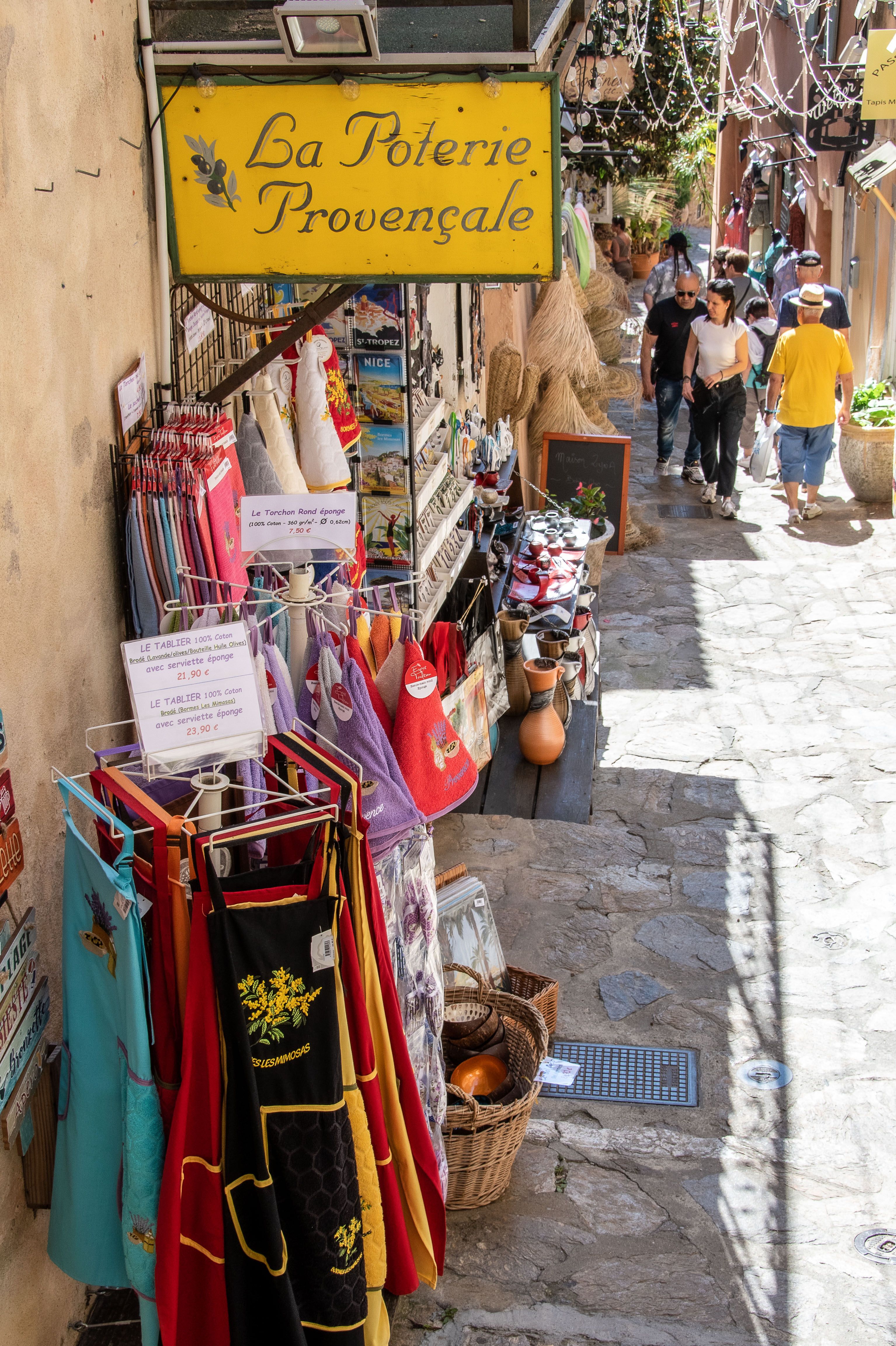 People Walking in Alleys Between Colorful Buildings · Free Stock Photo