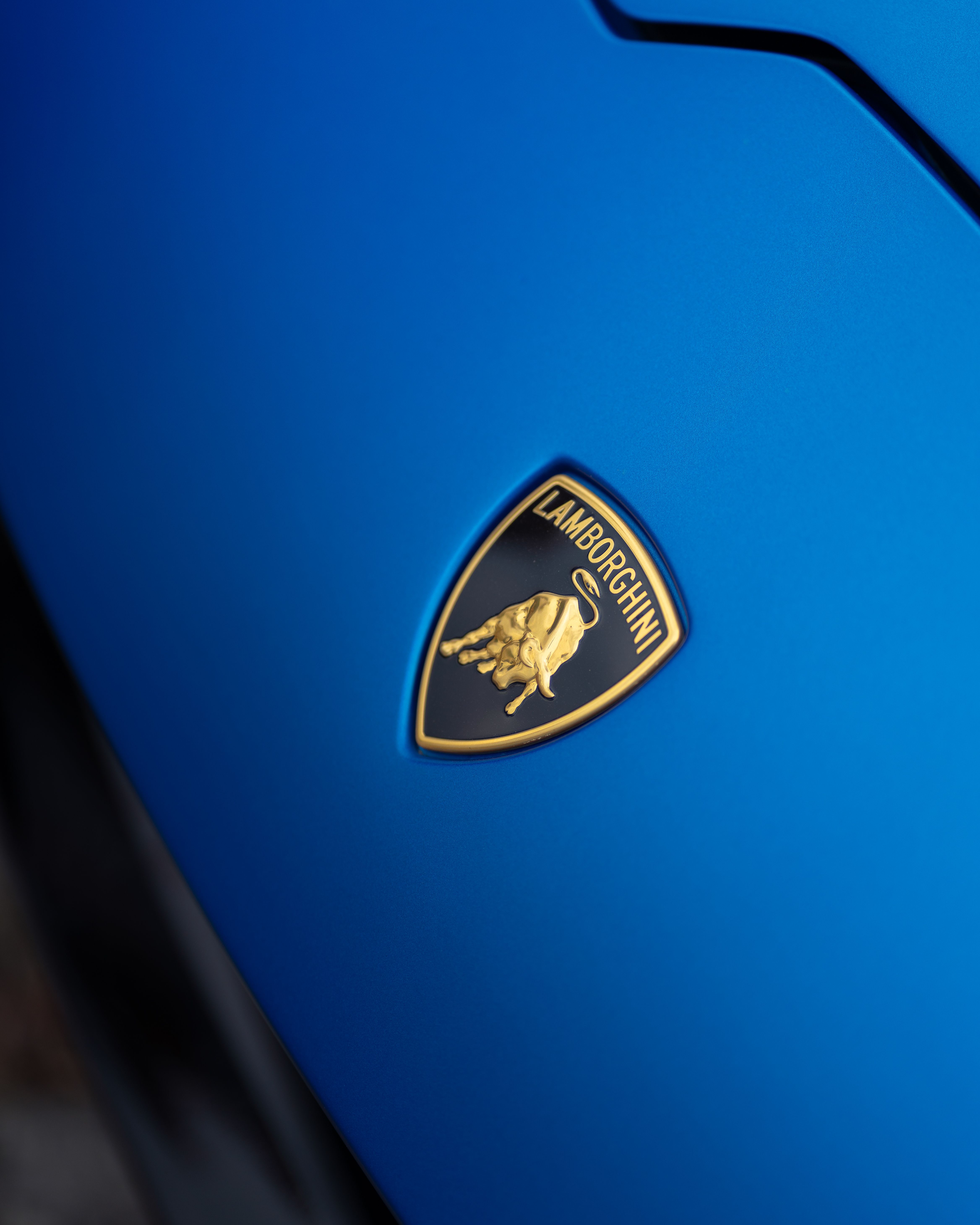 Close Up Shot of a Lamborghini Emblem · Free Stock Photo