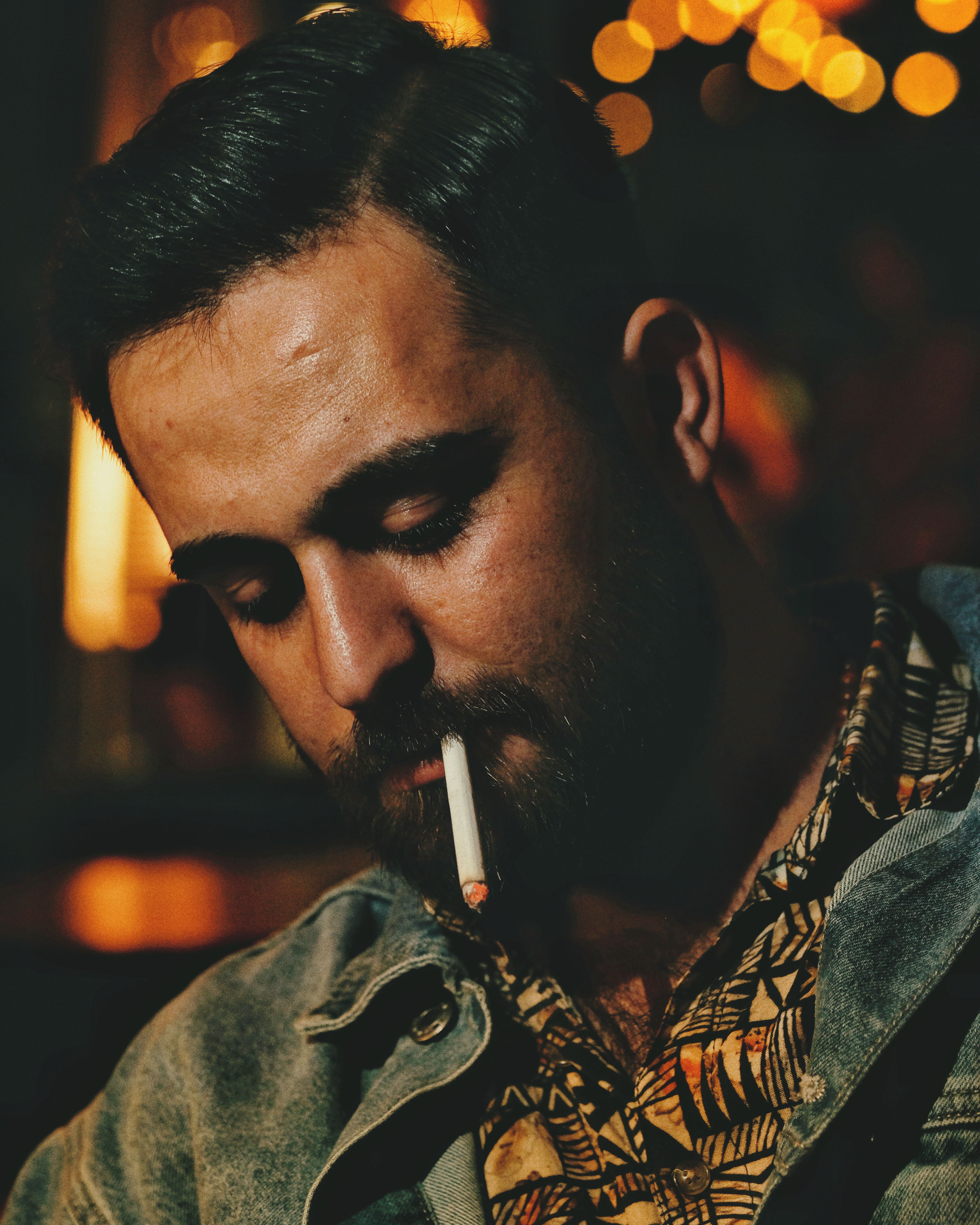Face of Man Smoking Cigarette · Free Stock Photo