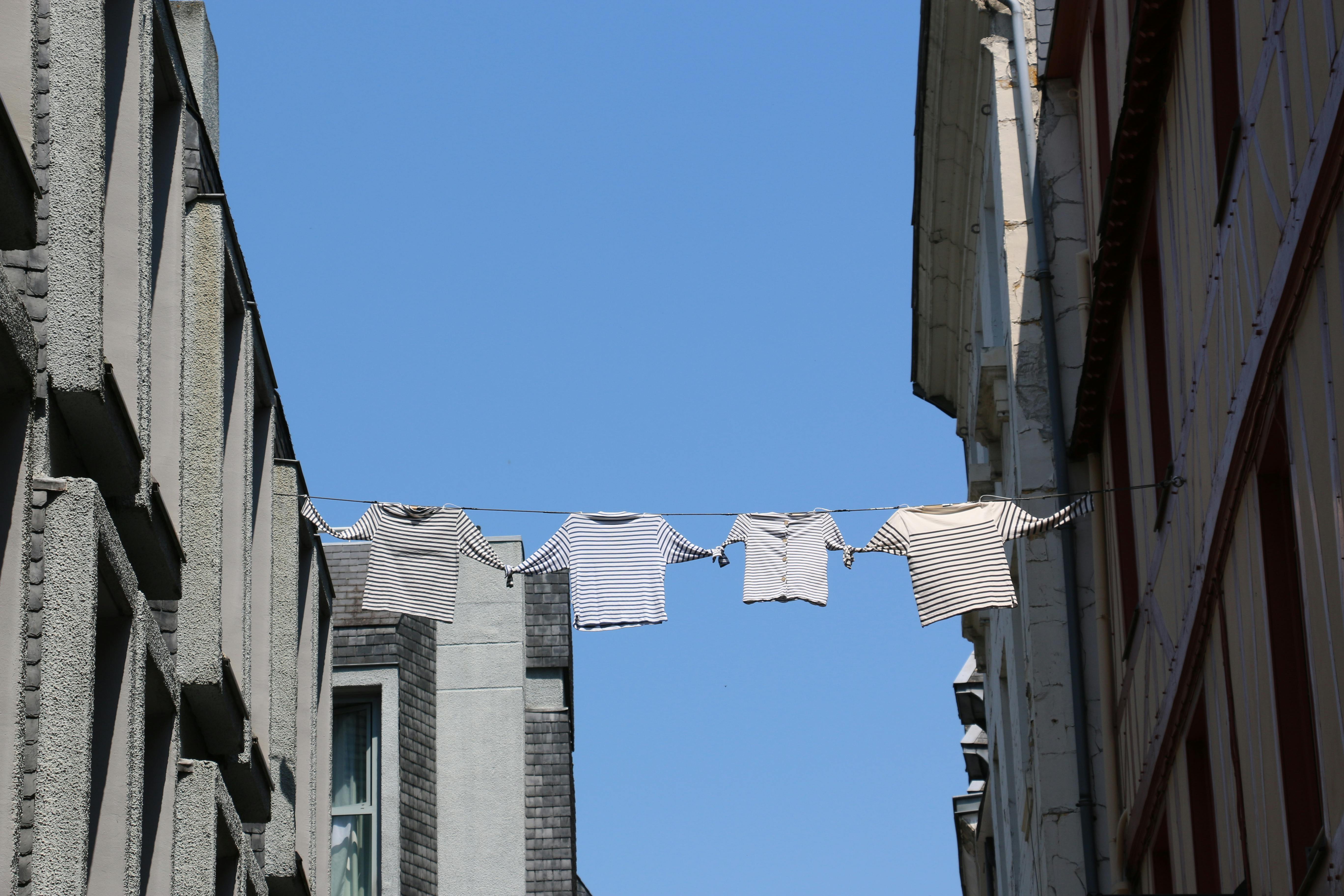 Clothes Drying on String over Alley in Town · Free Stock Photo