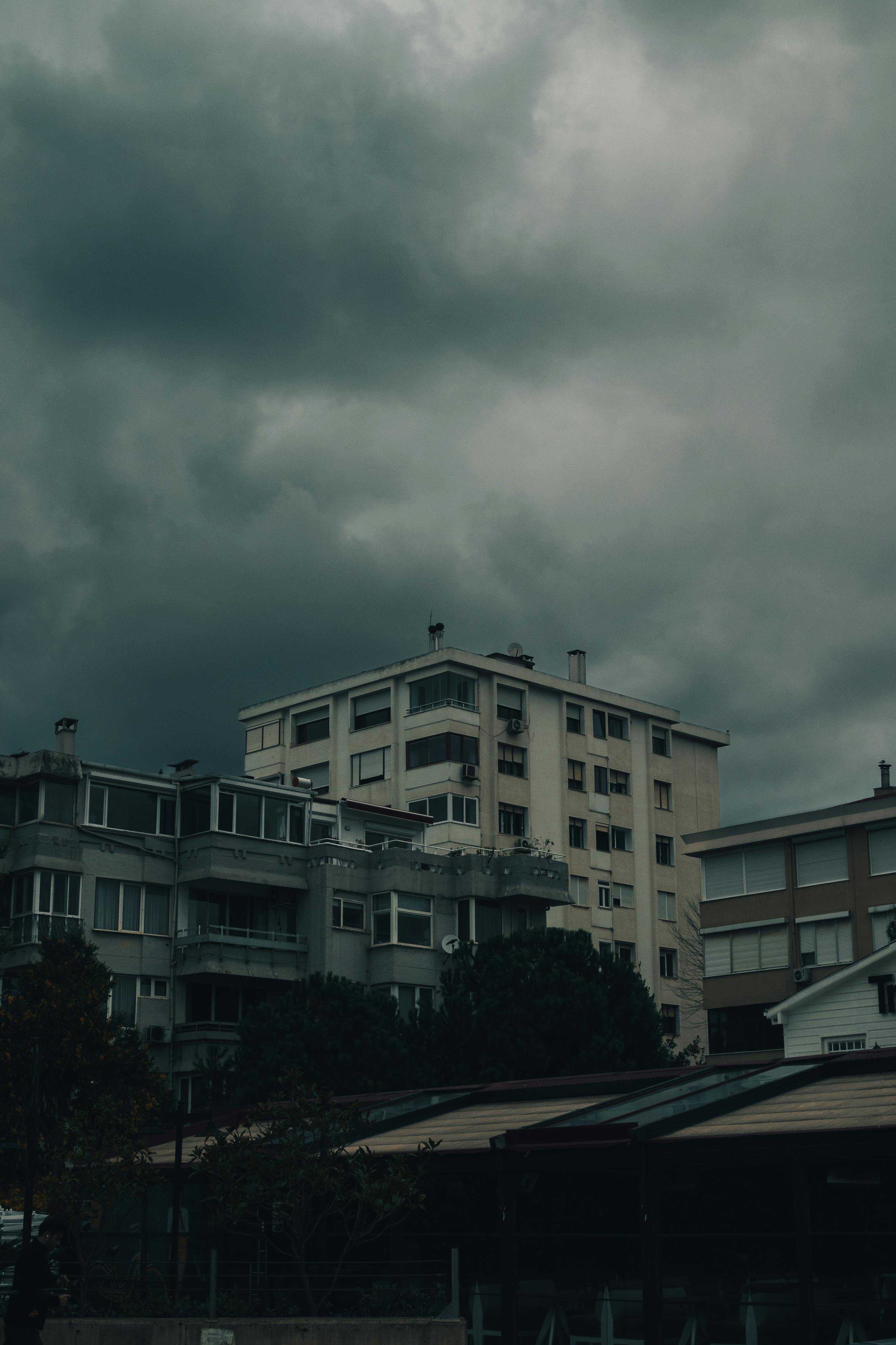 Storm Clouds Above House Buildings · Free Stock Photo
