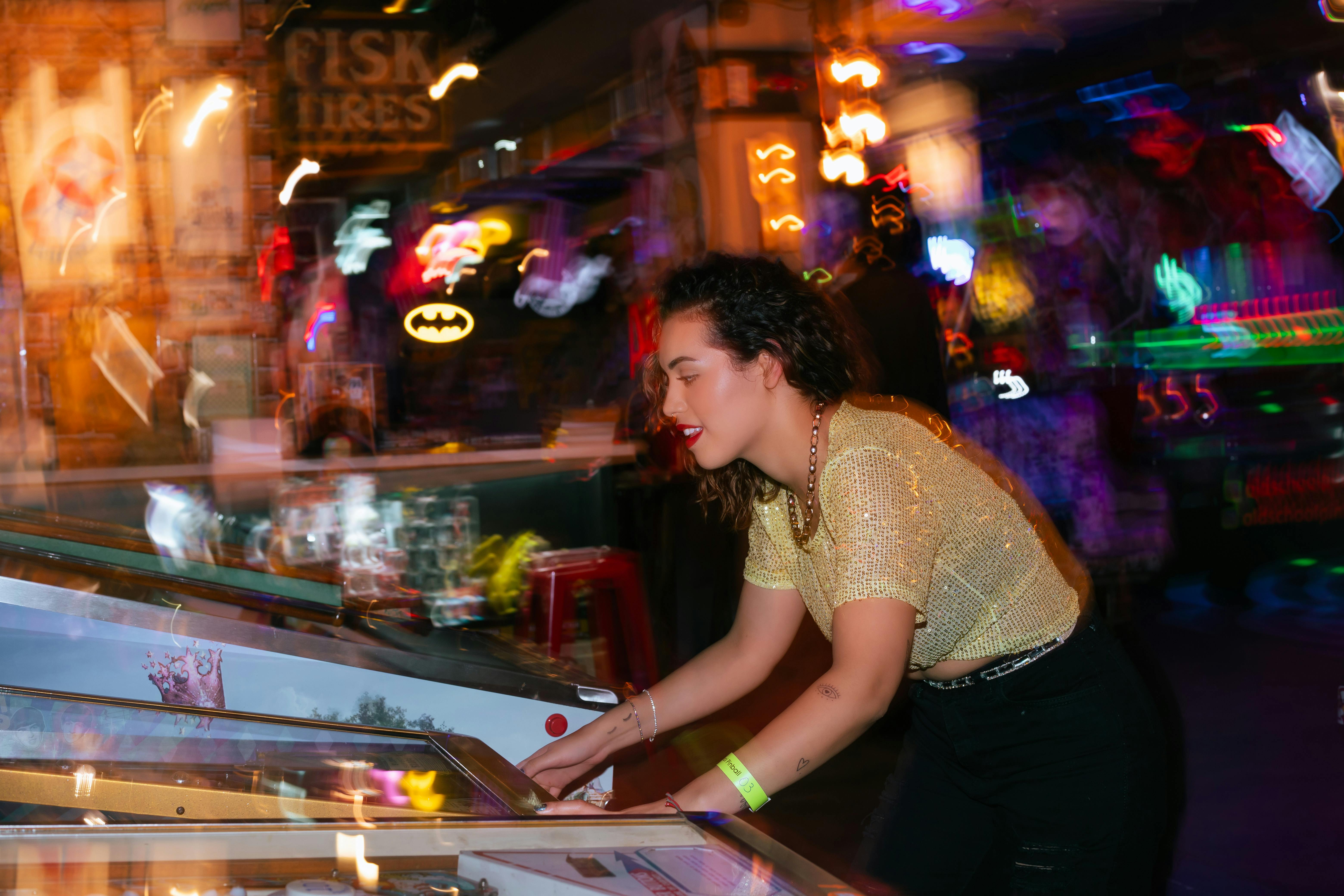 Woman Playing Game in Bar · Free Stock Photo
