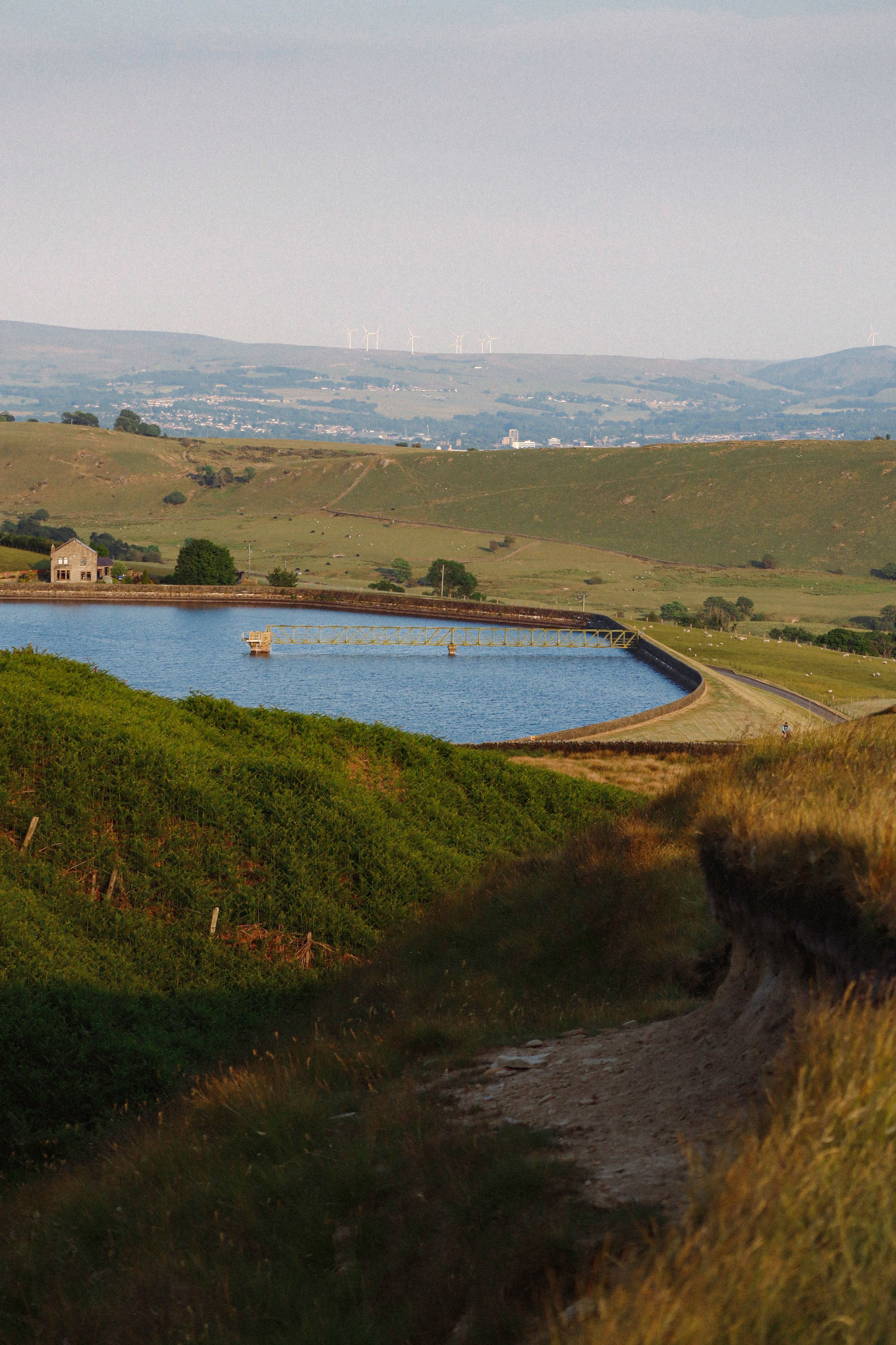 Reservoir with Pier in Rural Landscape · Free Stock Photo