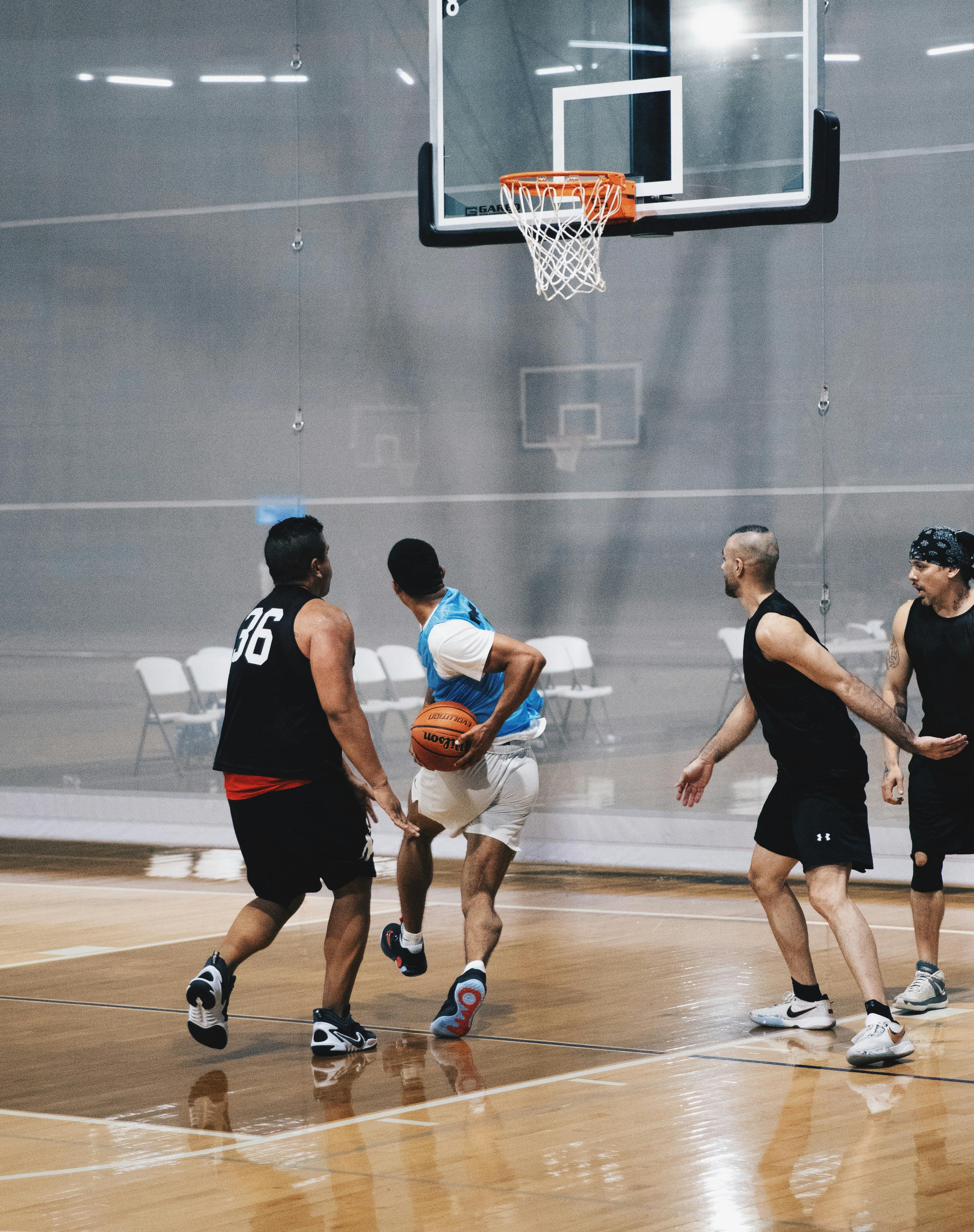 A Group of Men Playing Basketball · Free Stock Photo