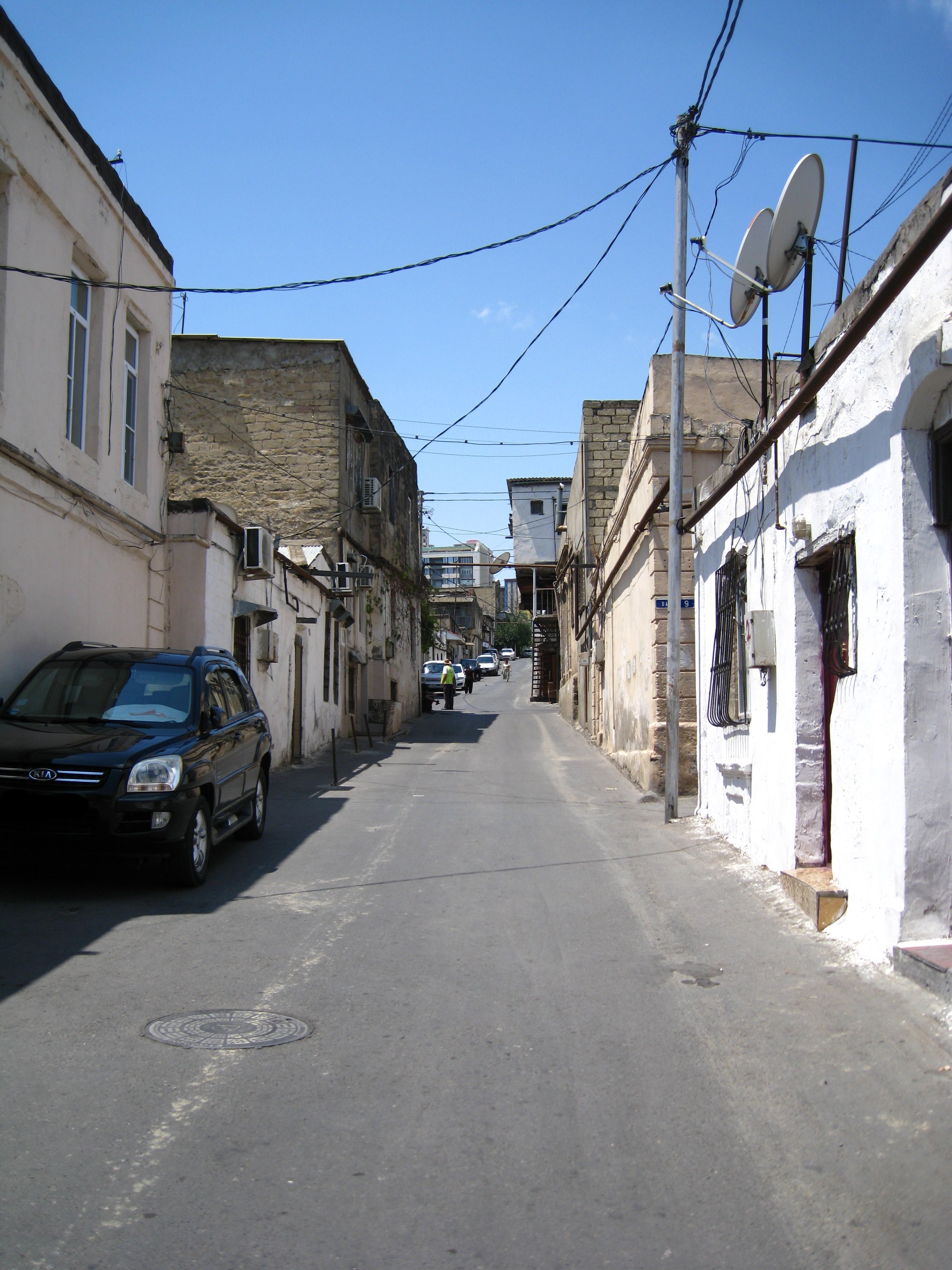 View of a Narrow Street between Houses in a Town · Free Stock Photo