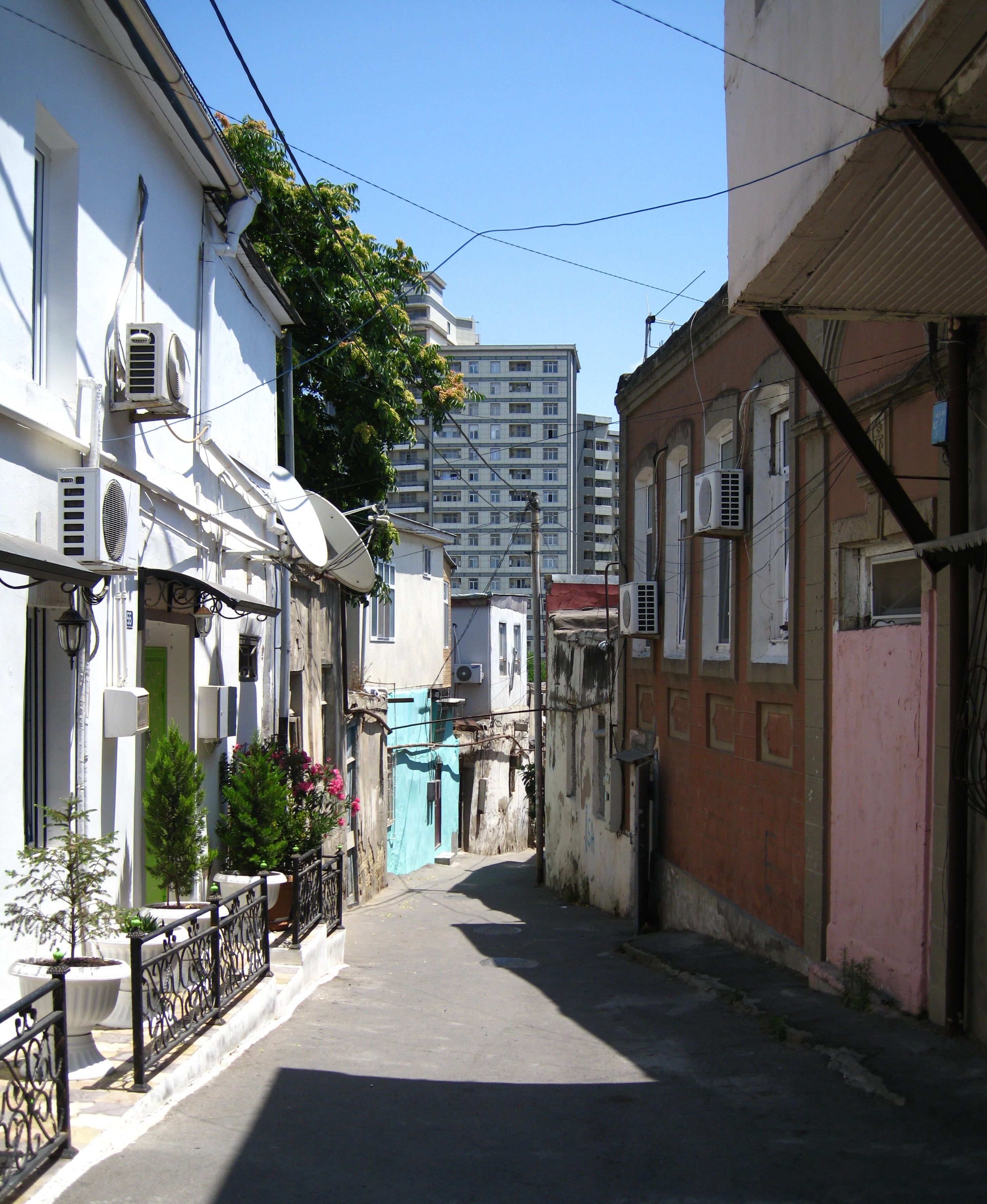 View of a Narrow Street between Houses in a City · Free Stock Photo