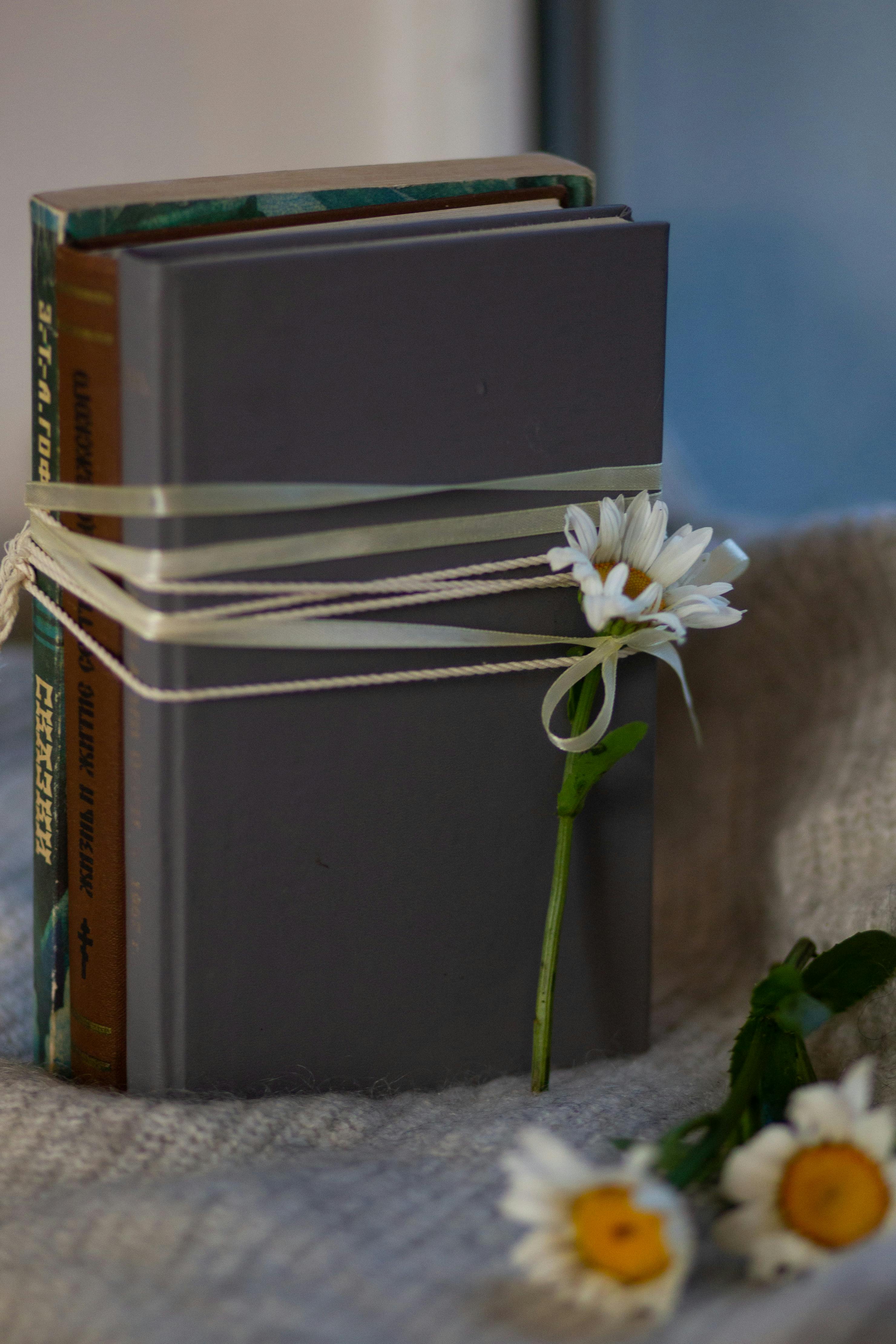 Flower Tied to Books · Free Stock Photo