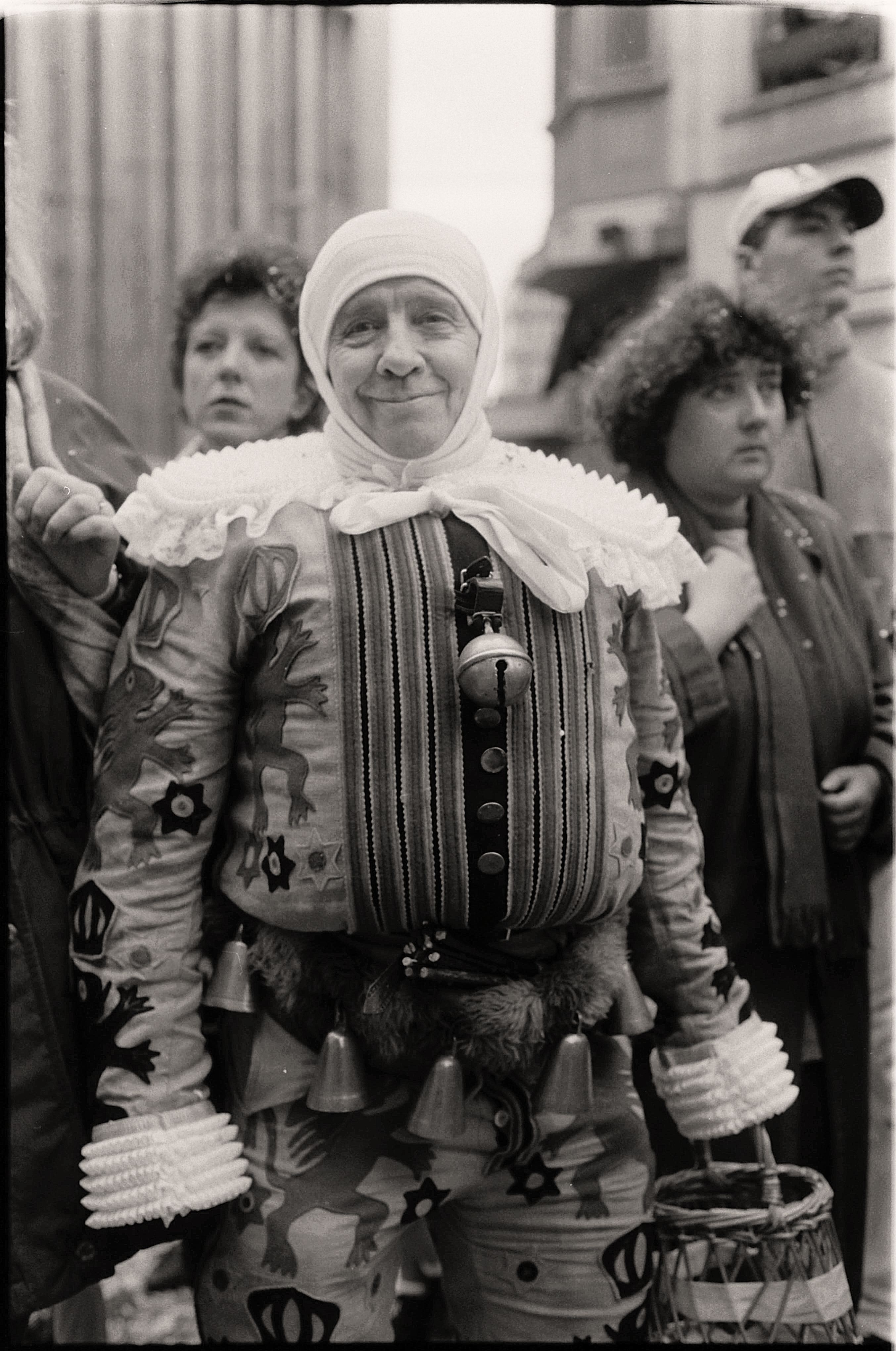 An Old Photograph of People in Costumes at a Parade on the Street ...