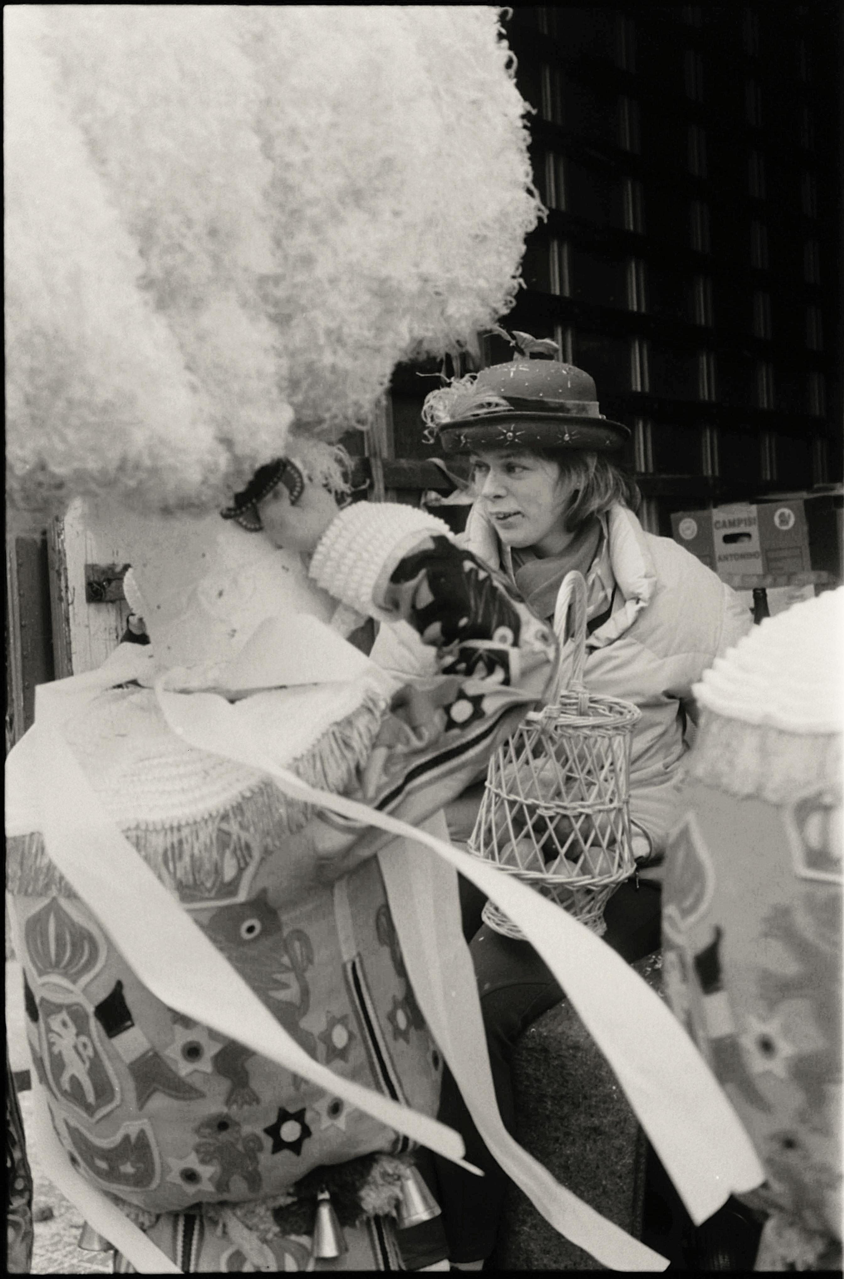 An Old Photograph of People in Costumes at a Parade on the Street ...