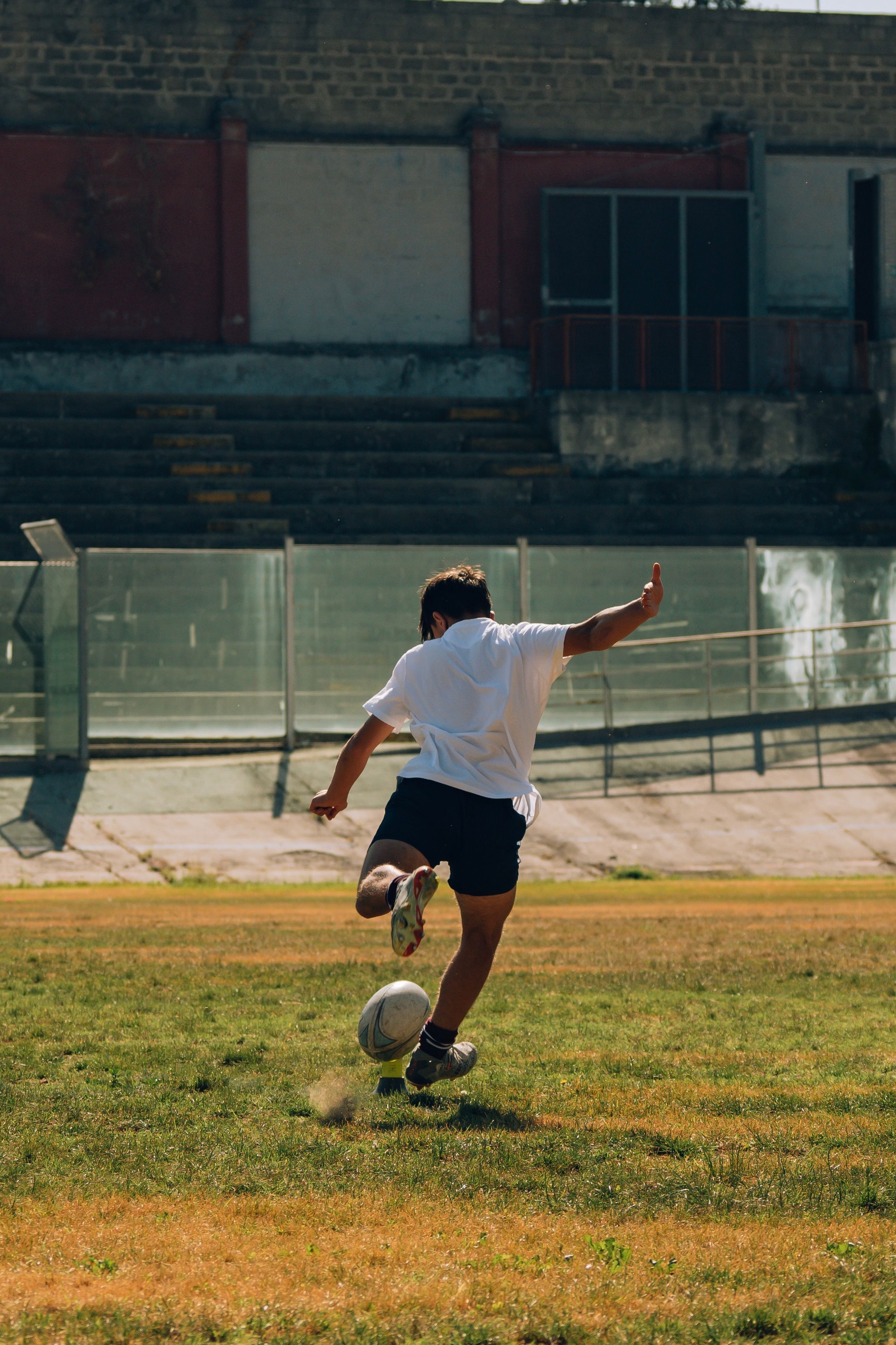 Man Playing Football on a Field · Free Stock Photo