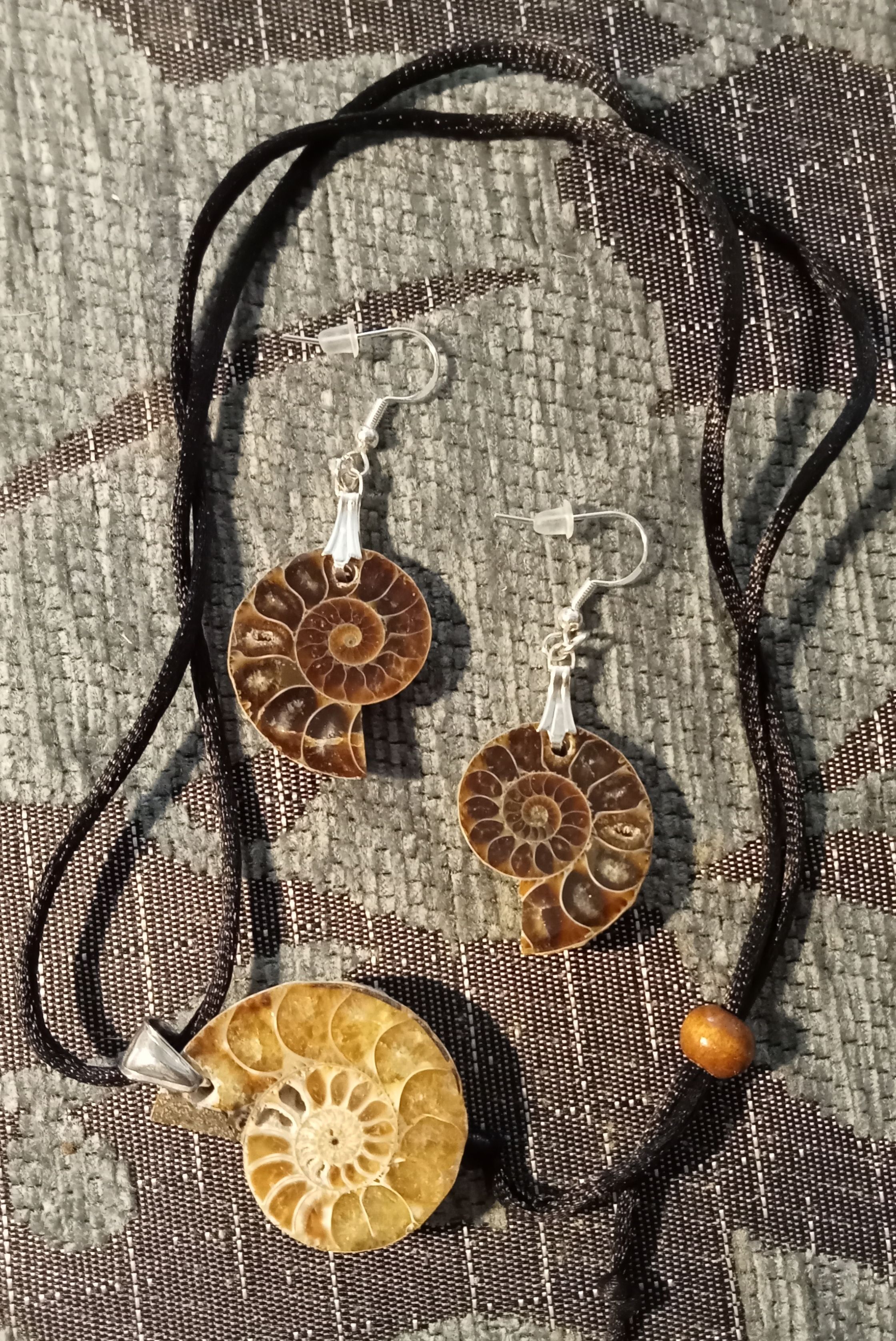 A Necklace and Earrings in the Shape of Snail Shells · Free Stock Photo