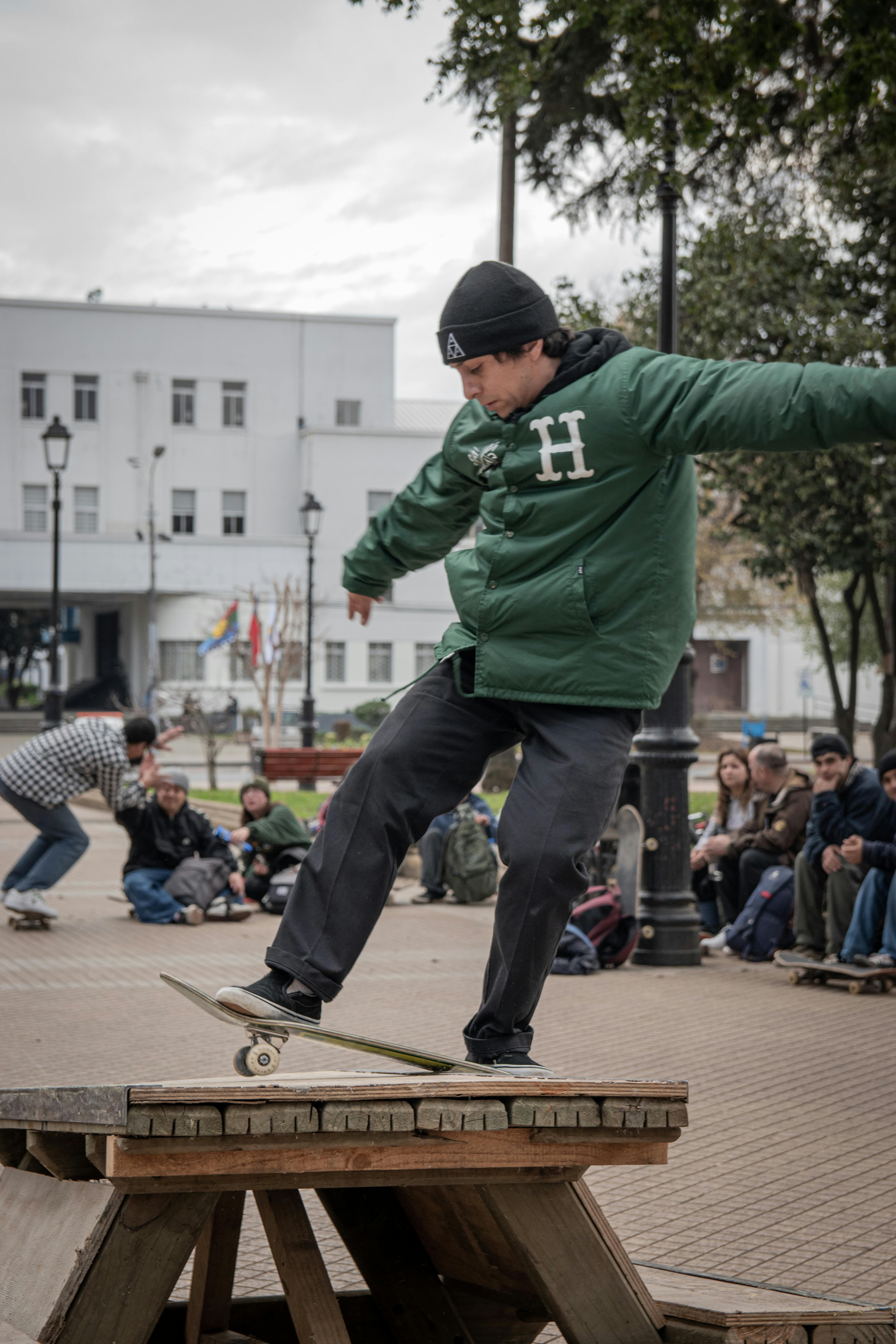 Man Skateboarding on Table in Town · Free Stock Photo