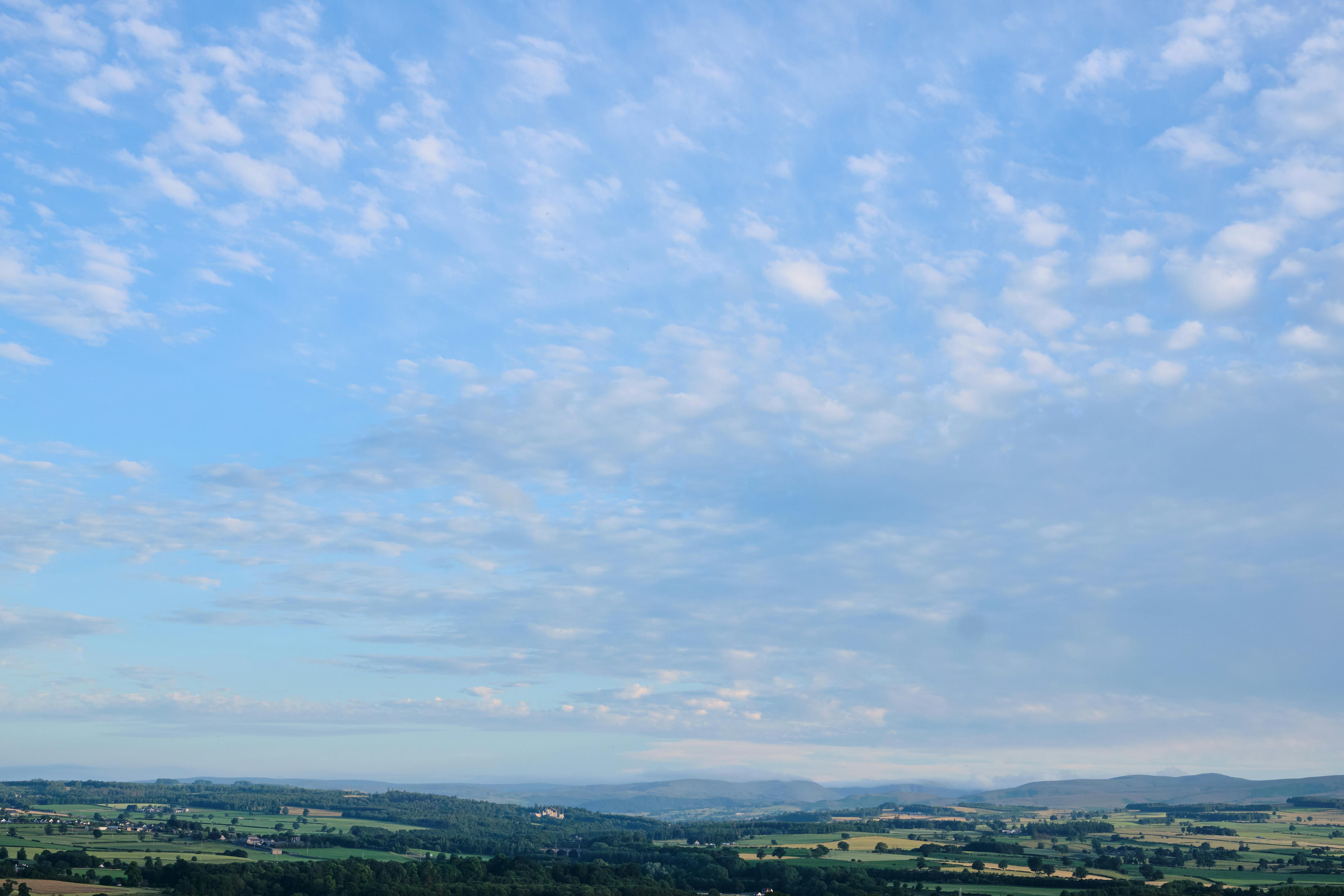 Sun Rising behind Clouds Illuminating River Running across Snowy Plains ...
