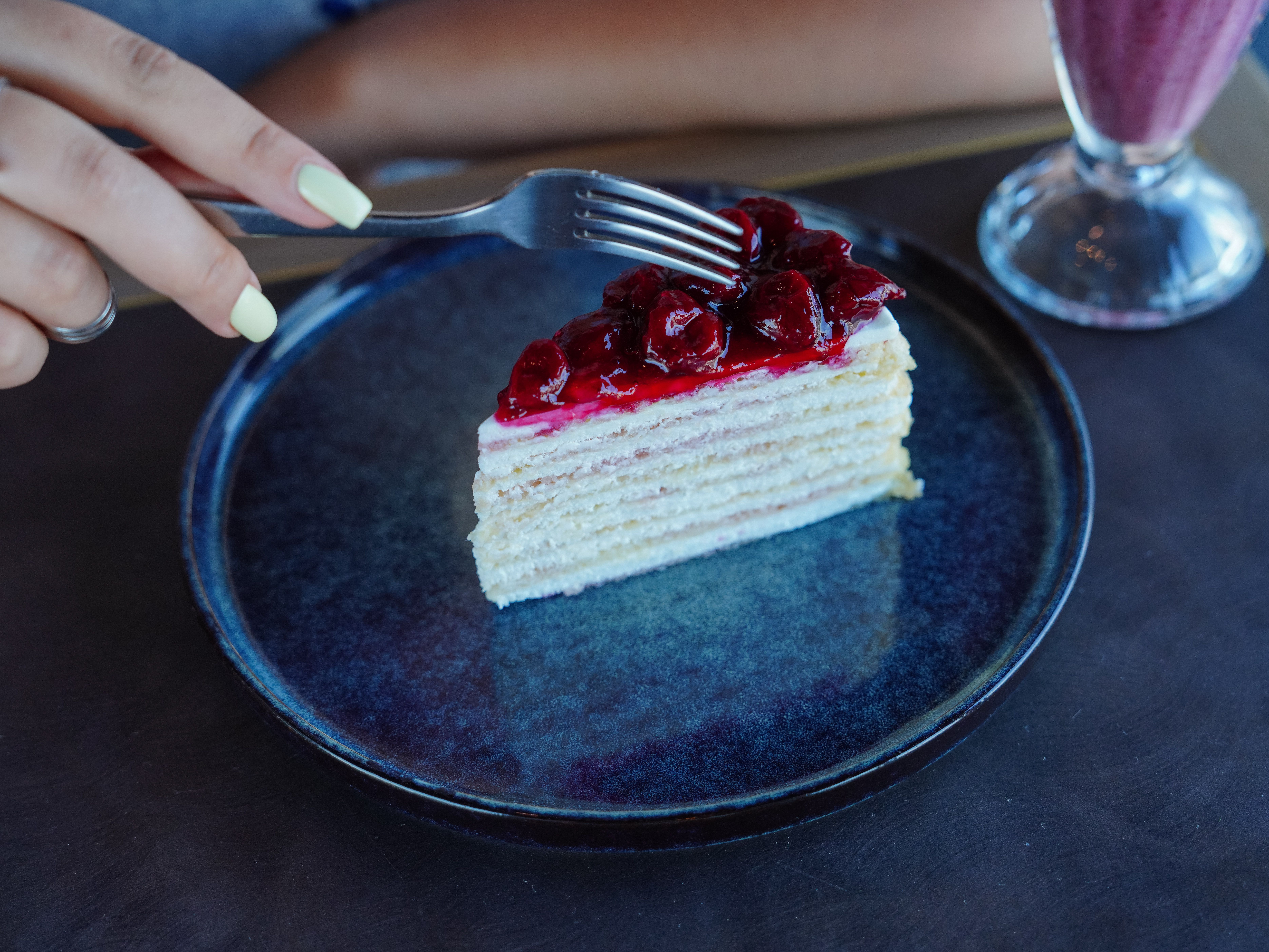 Sliced White and Pink Icing Covered Cake on White Plate With Silver ...