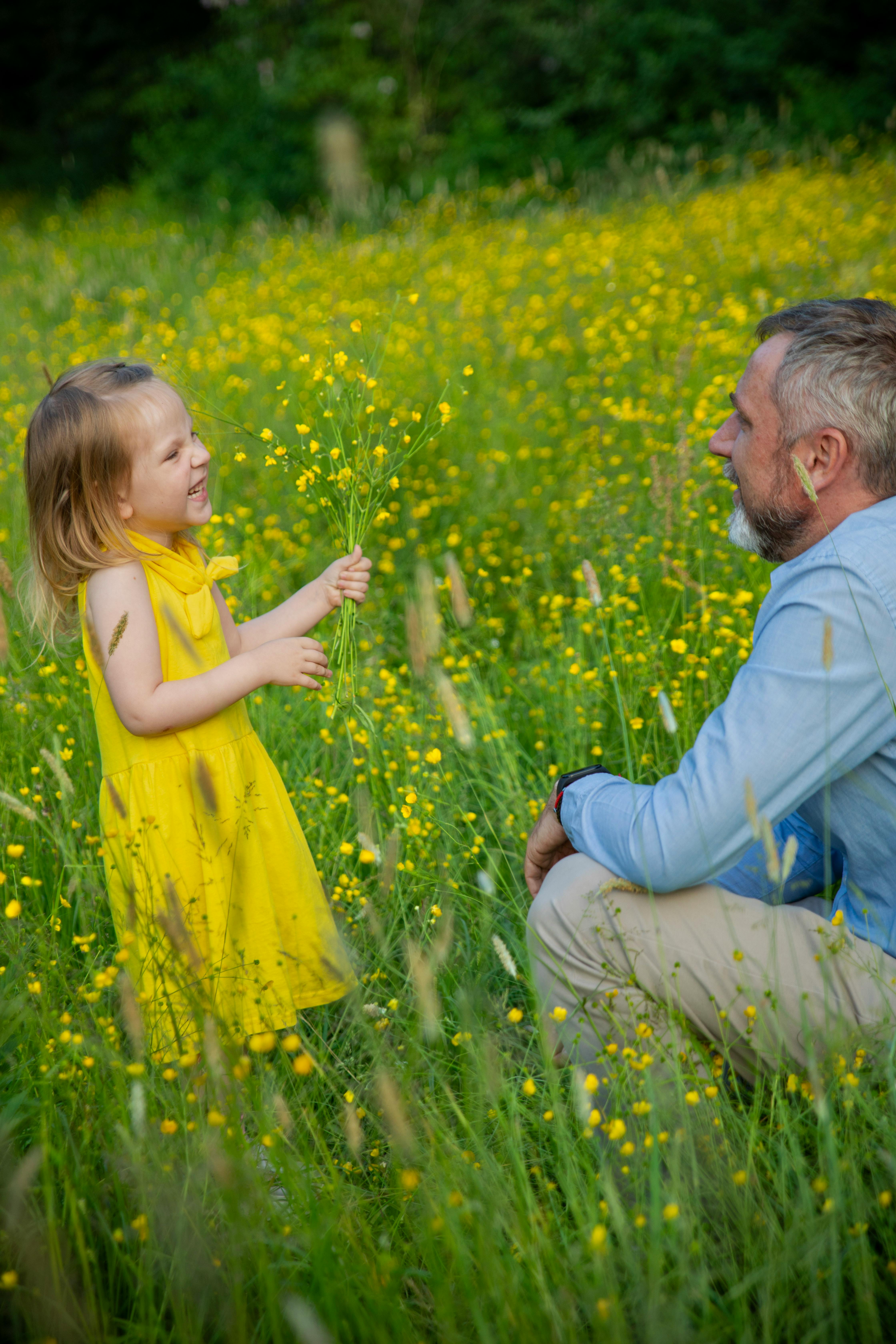 Father and Smiling Daughter on Meadow · Free Stock Photo