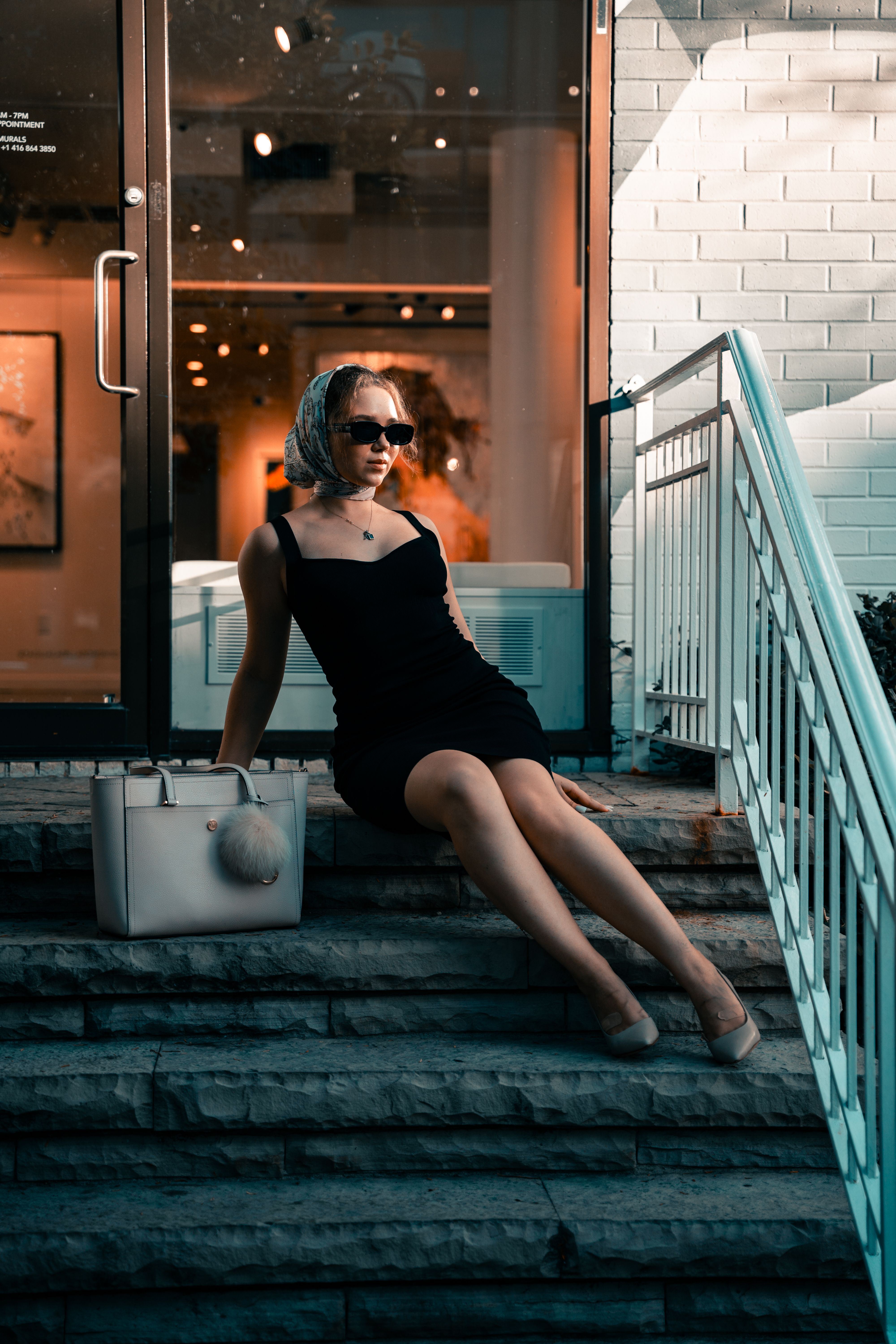 Woman Sitting and Posing on Stairs · Free Stock Photo