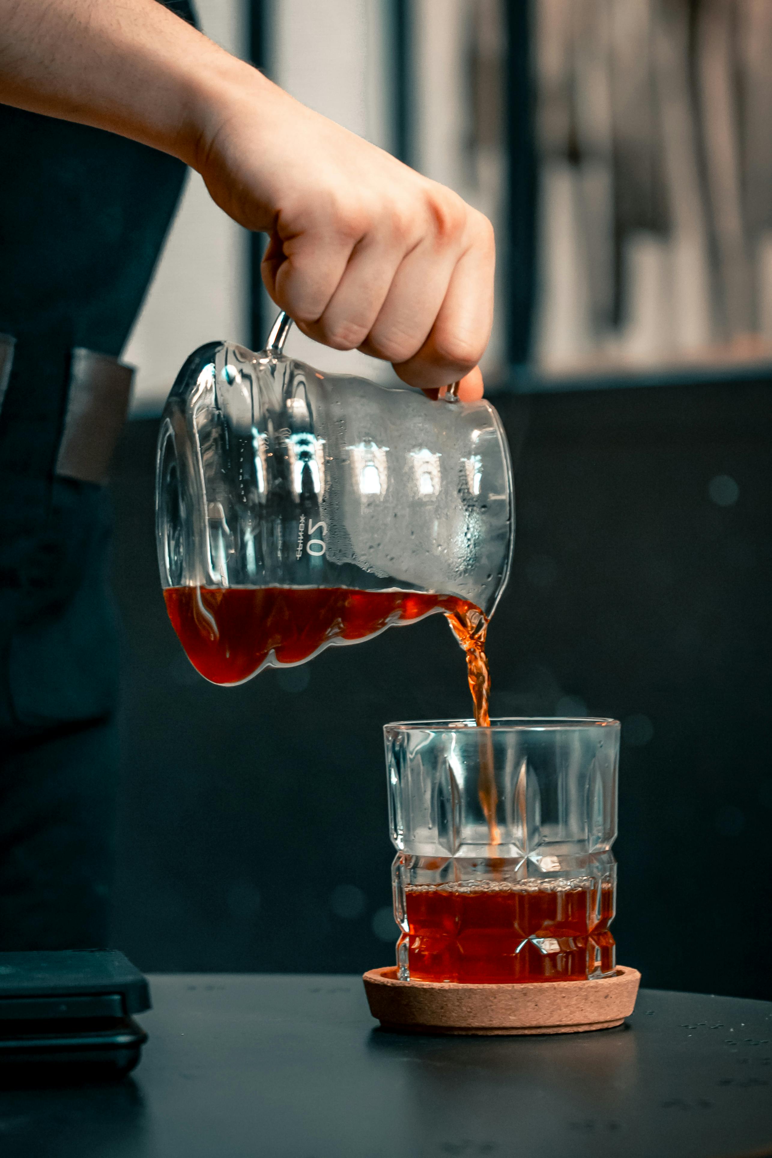 Woman Serving Tea in a Restaurant · Free Stock Photo