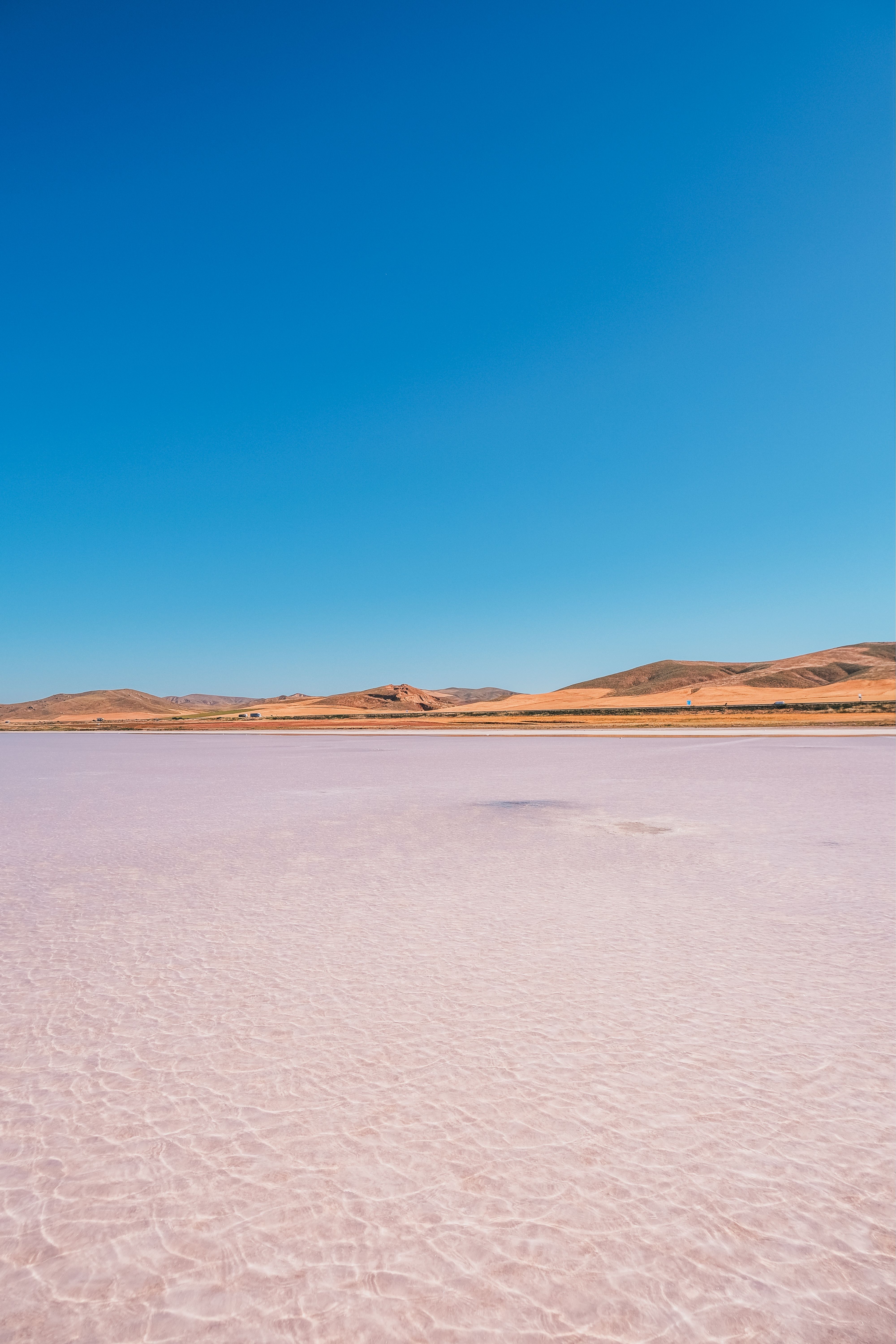 Arid Landscape with Saline Lake and Hills · Free Stock Photo