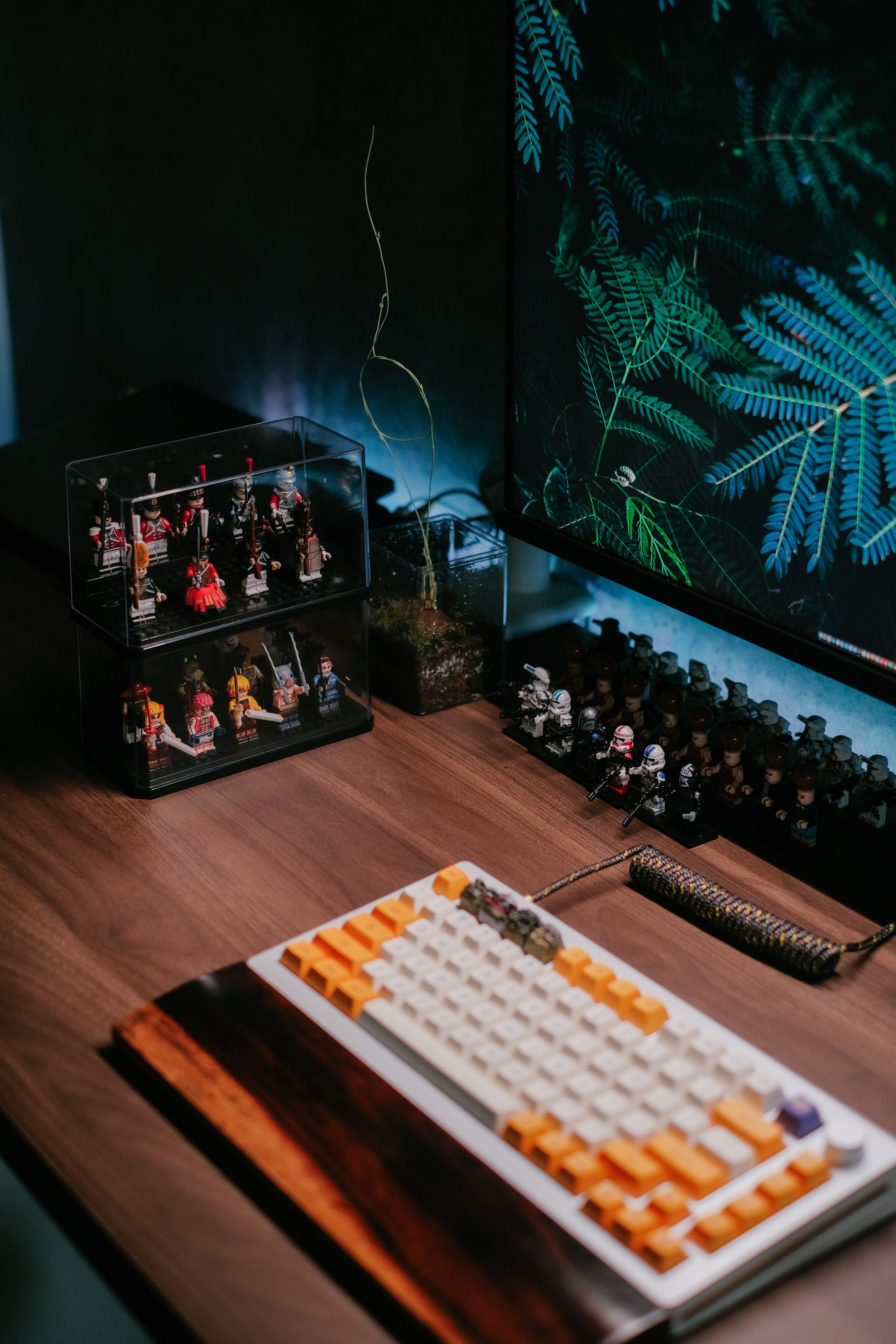Collection of Action Figures Displayed on a Desk with a Computer ...