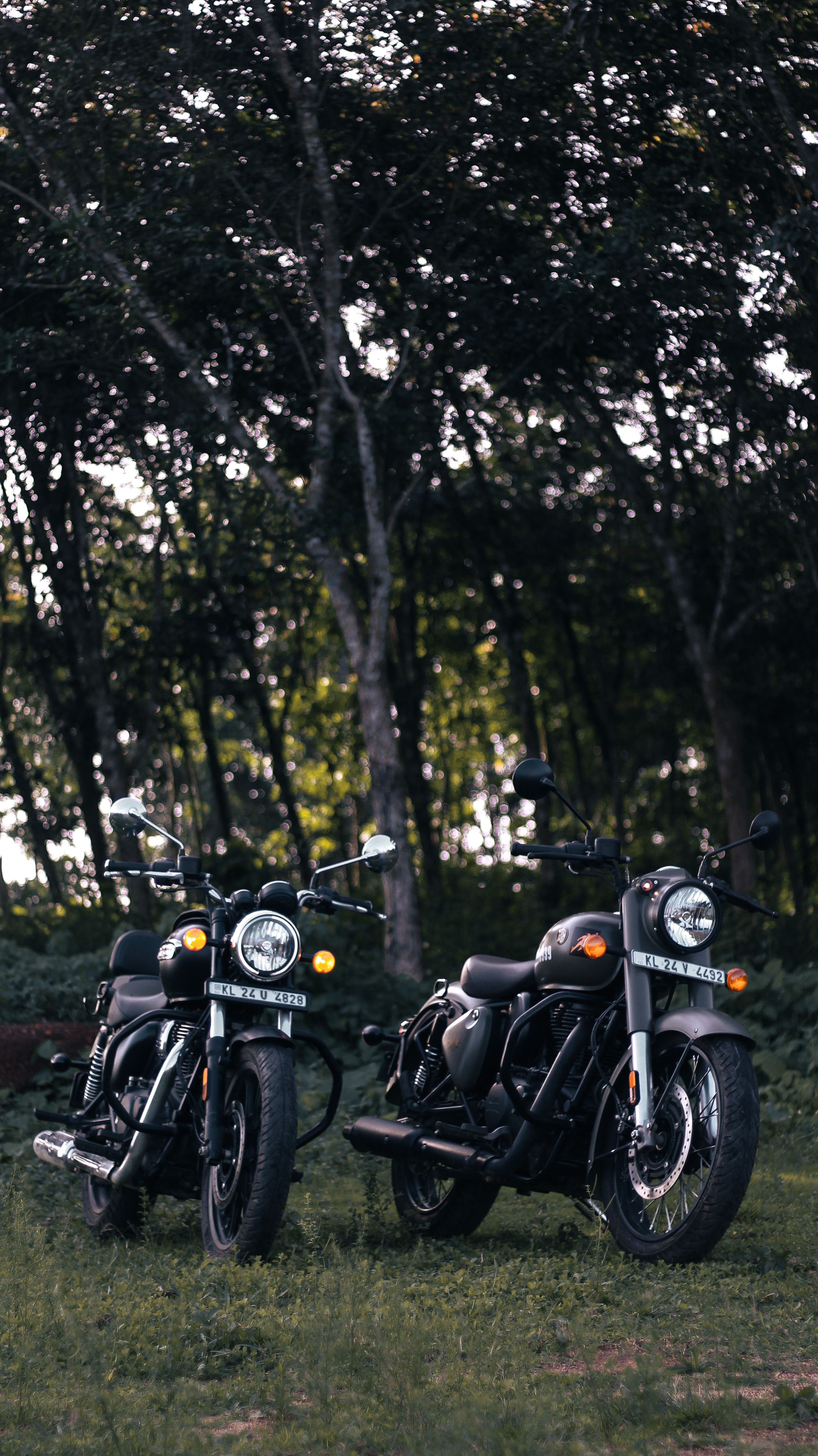 Royal Enfield Motorcycle Parked Beside a Post · Free Stock Photo