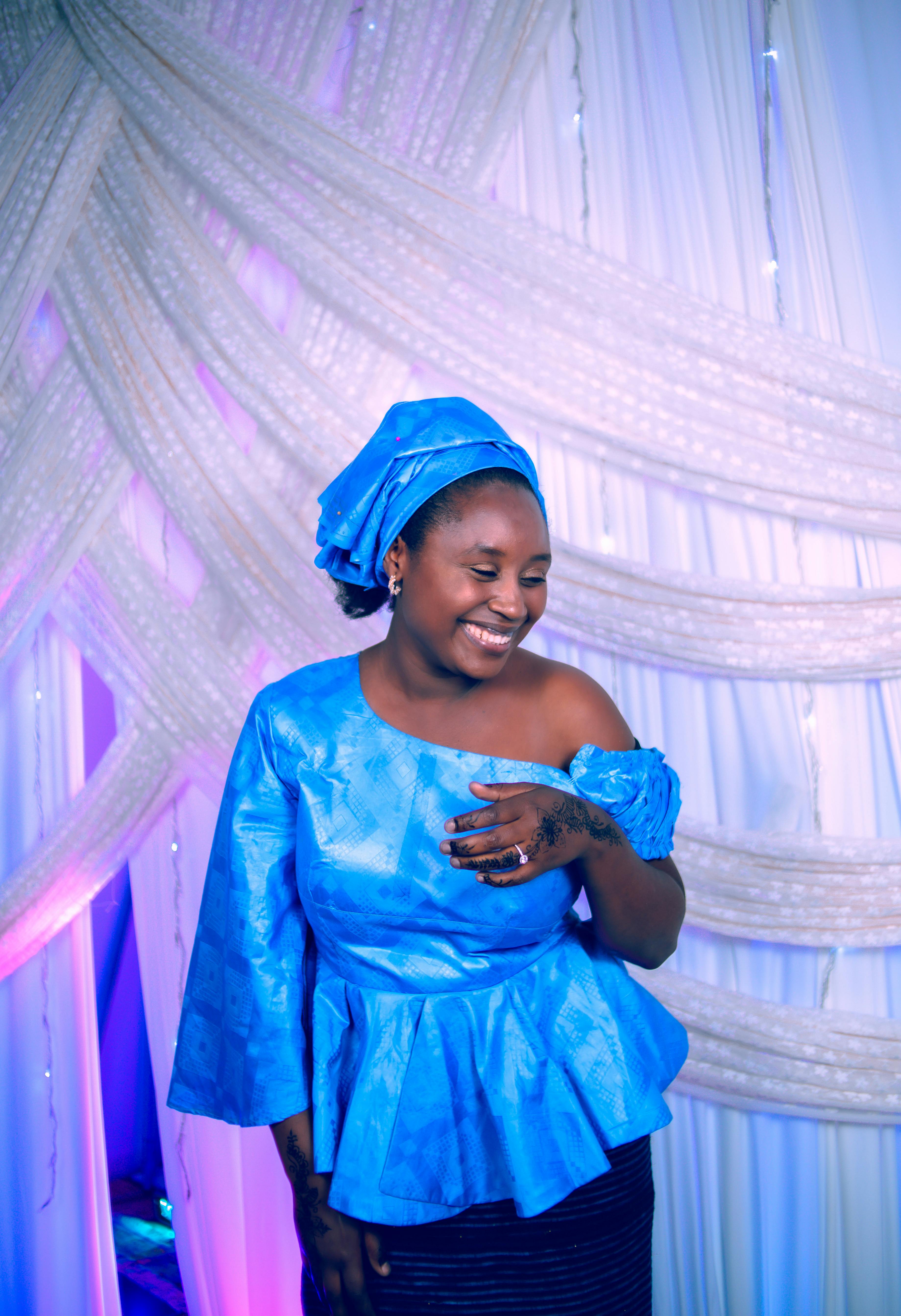 Smiling Woman in Blue Clothes · Free Stock Photo