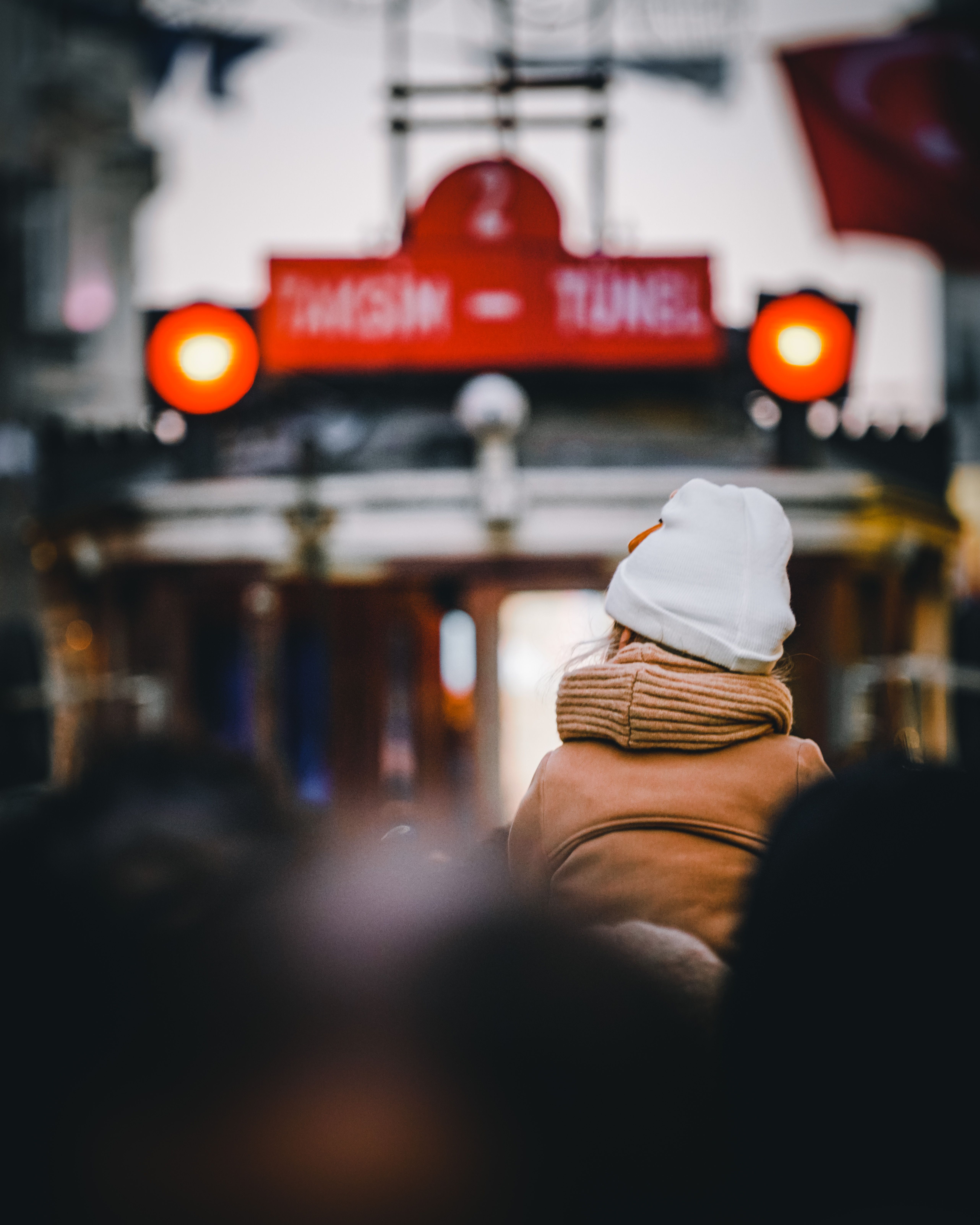 Child on Shoulder in Crowd on City Street · Free Stock Photo