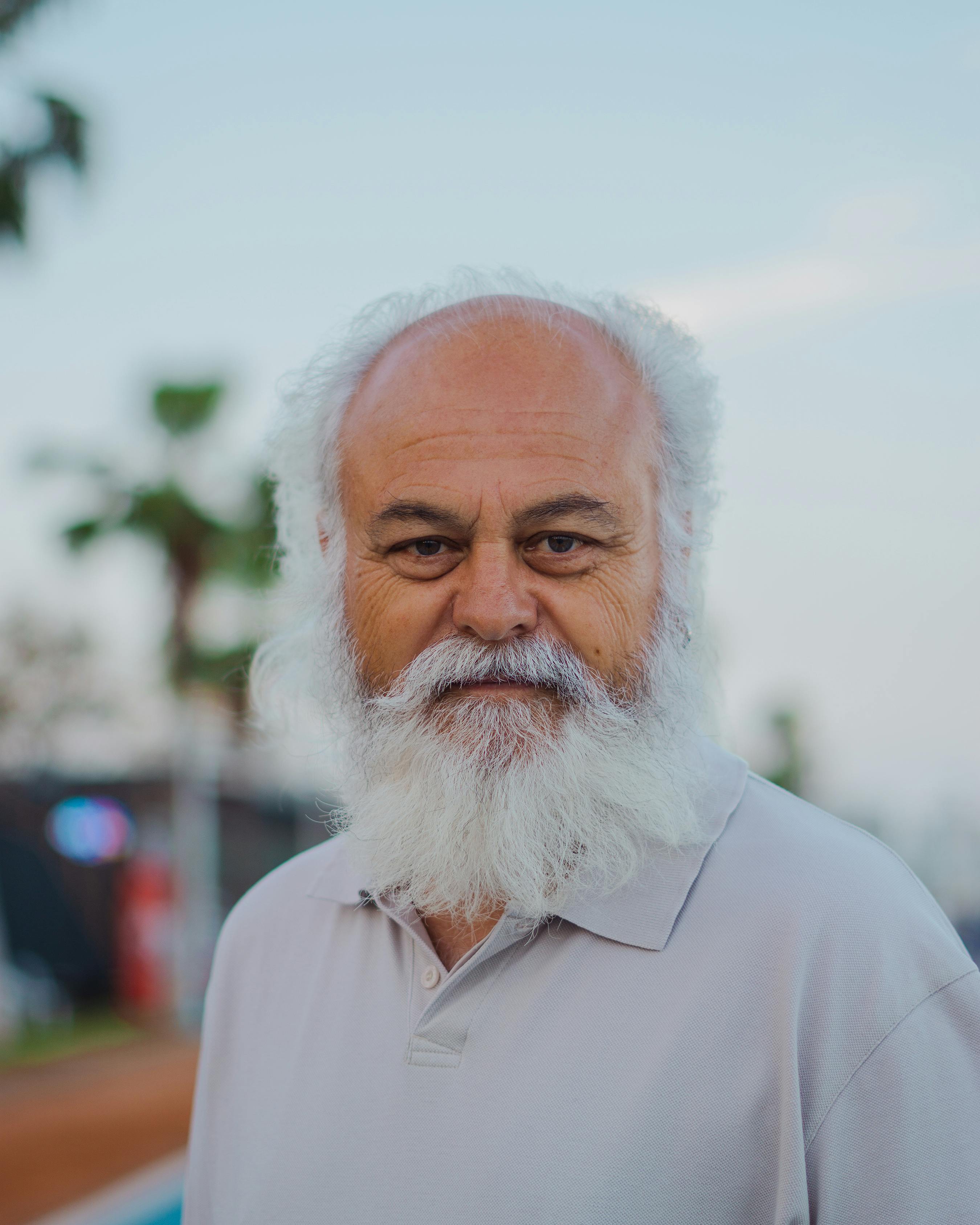 Man in Brown Sweater Smiling · Free Stock Photo