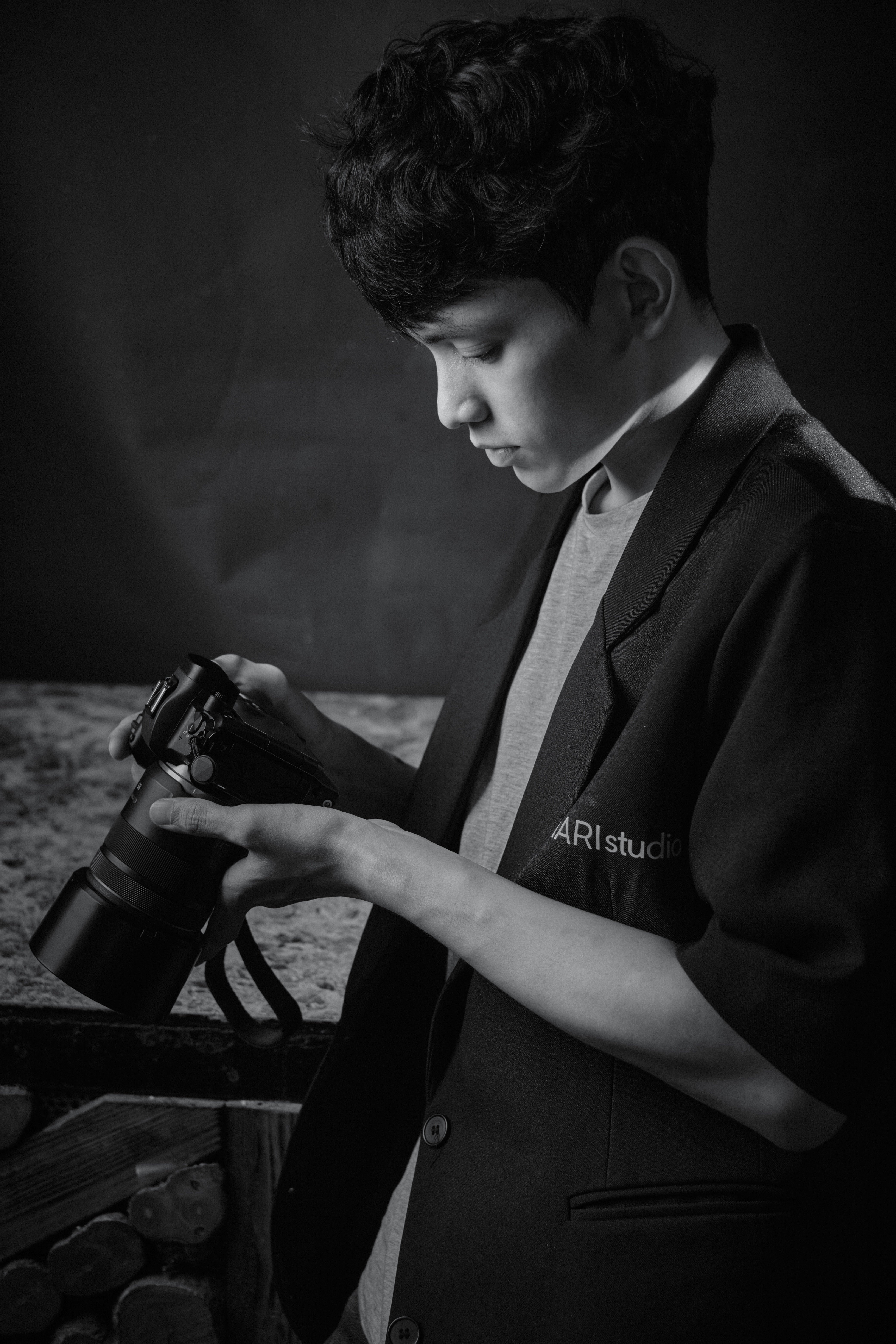 Photographer Looking down at his Camera · Free Stock Photo