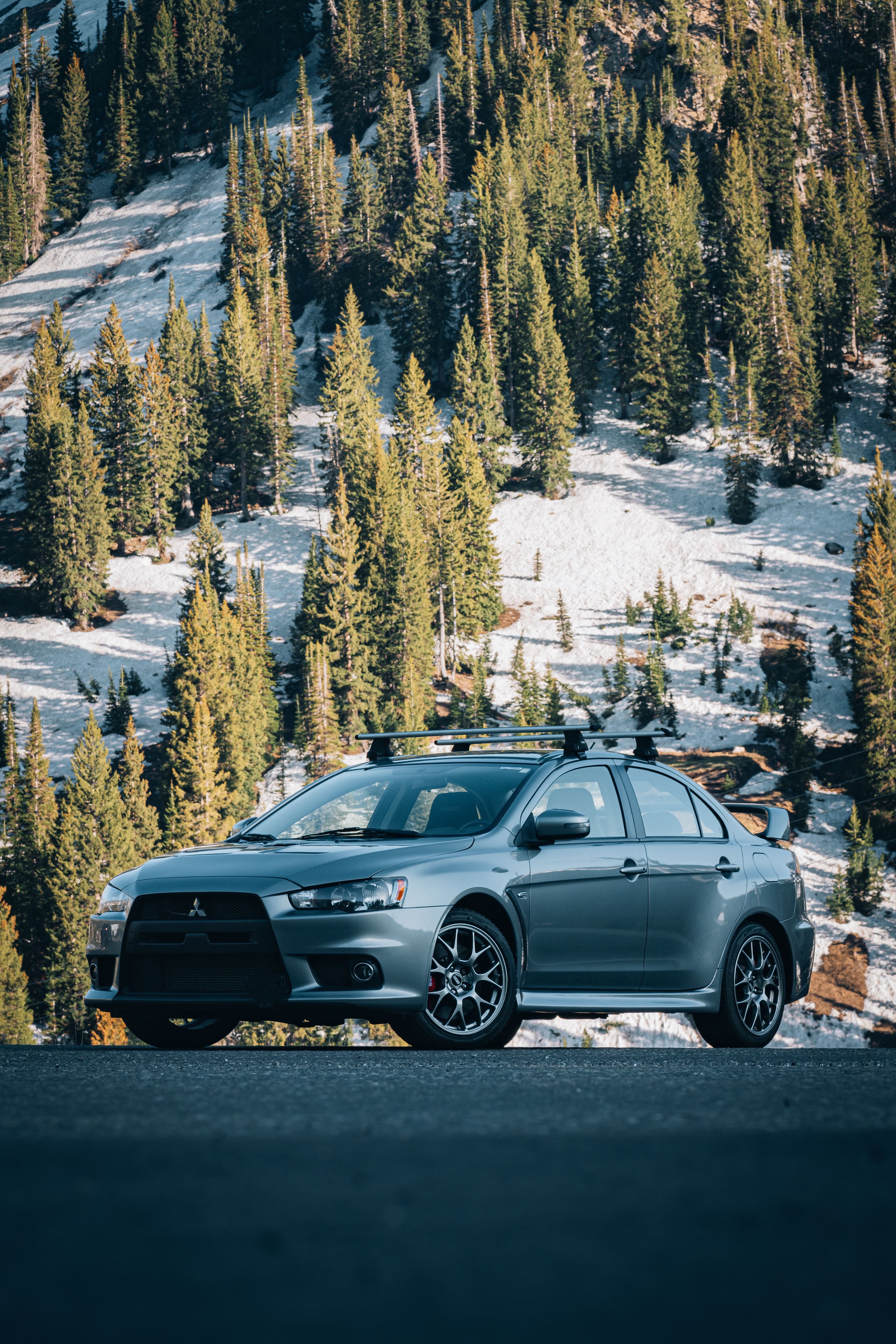 Silver Mitsubishi Lancer in Mountains in Winter · Free Stock Photo